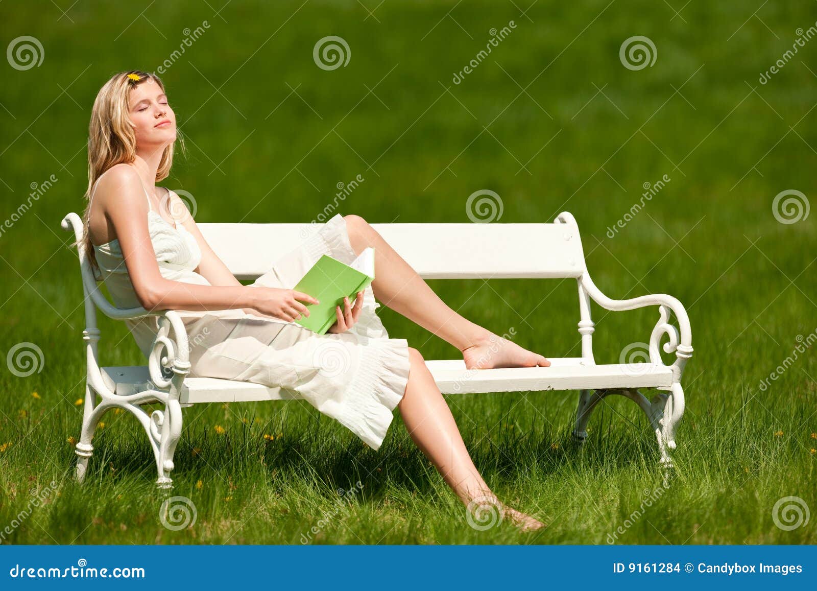 Summer - Woman Sitting on Bench in Meadow Stock Photo - Image of ...