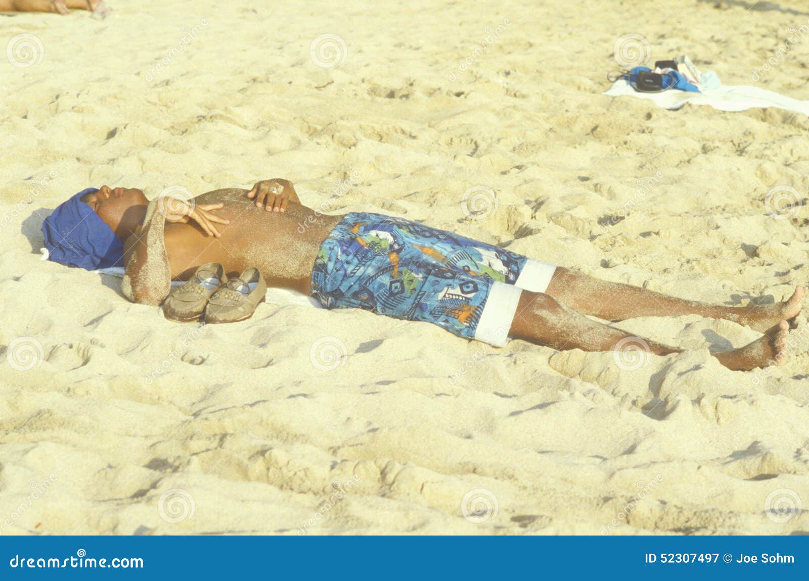 Sun Bather, Kauai, HI editorial photography. Image of beach - 52307497