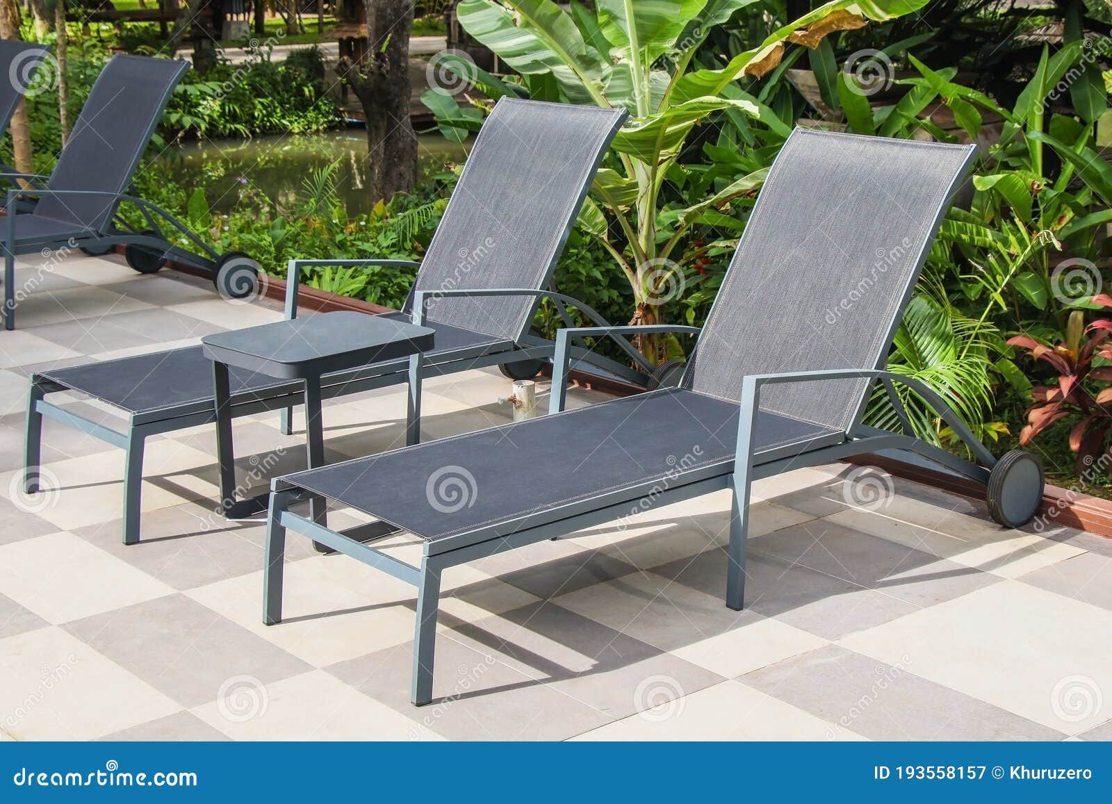 Sun bed beside the pool stock image. Image of blue, paradise - 193558157