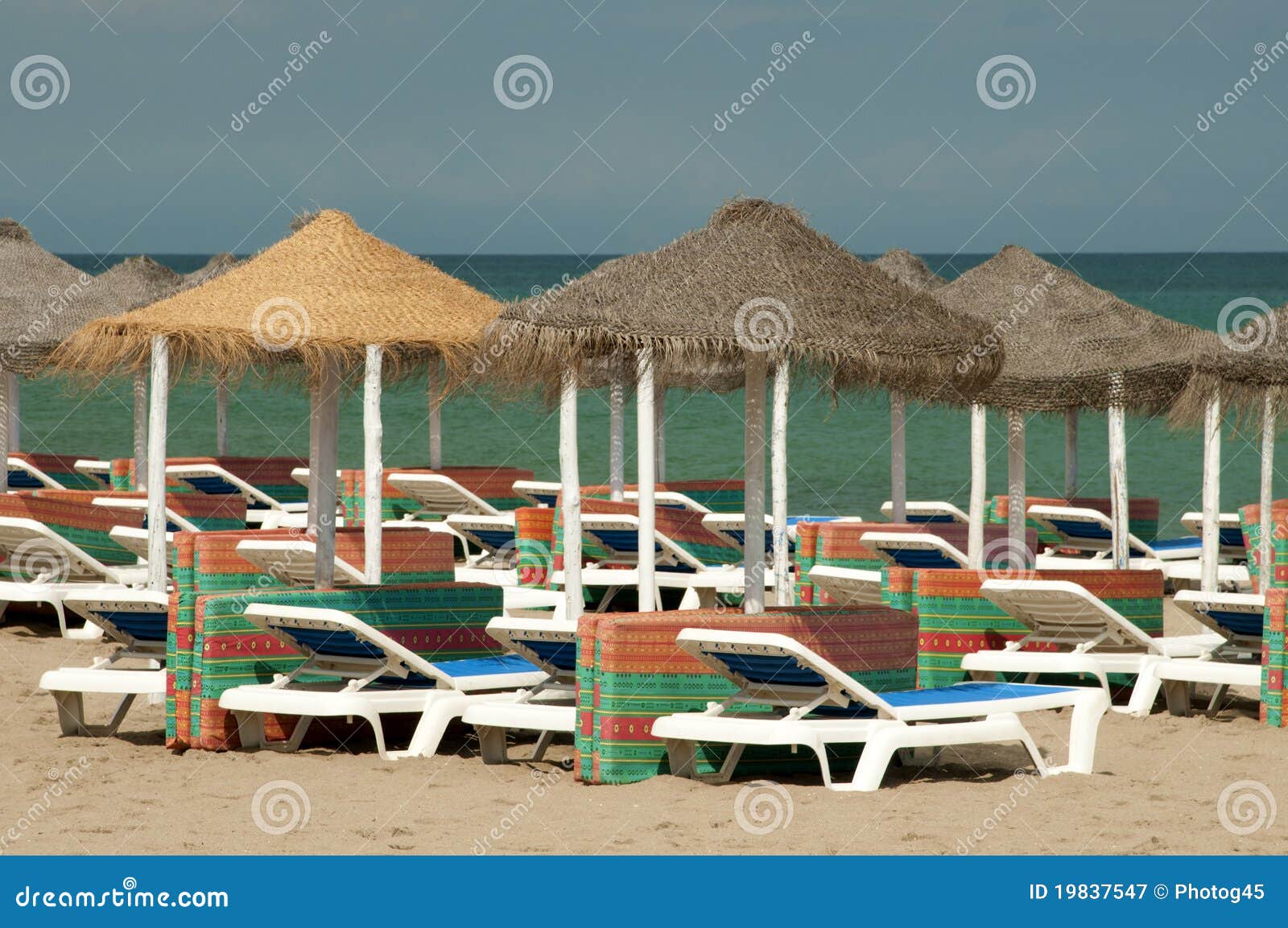 Sun beds on the beach stock image. Image of hotel, beds - 19837547