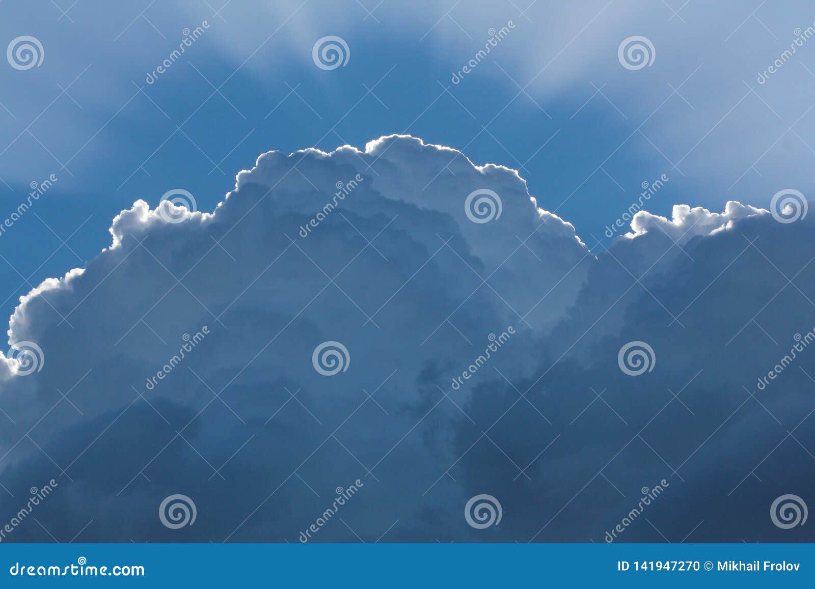 The Sun Behind the Cloud. the Sun`s Rays Pass through the Clouds. Stock ...