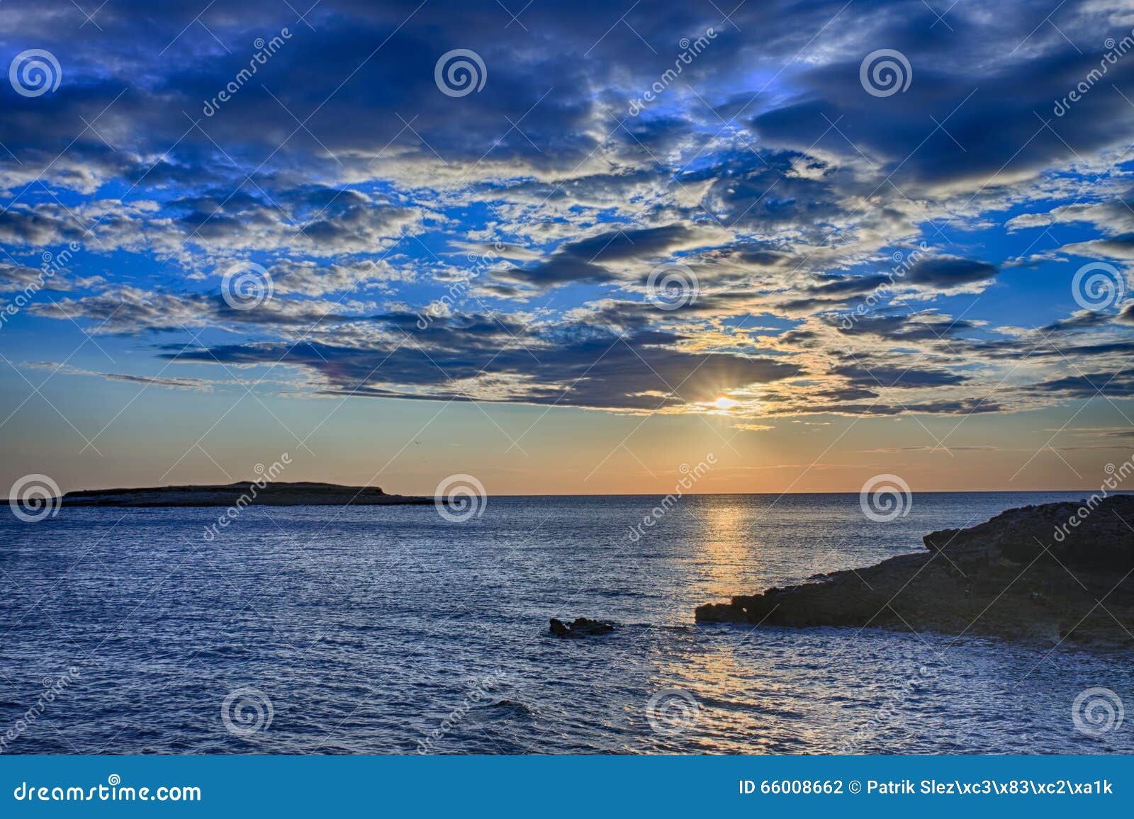 Sun Behind Clouds Above Sea Level in Sunset Time Stock Photo - Image of ...