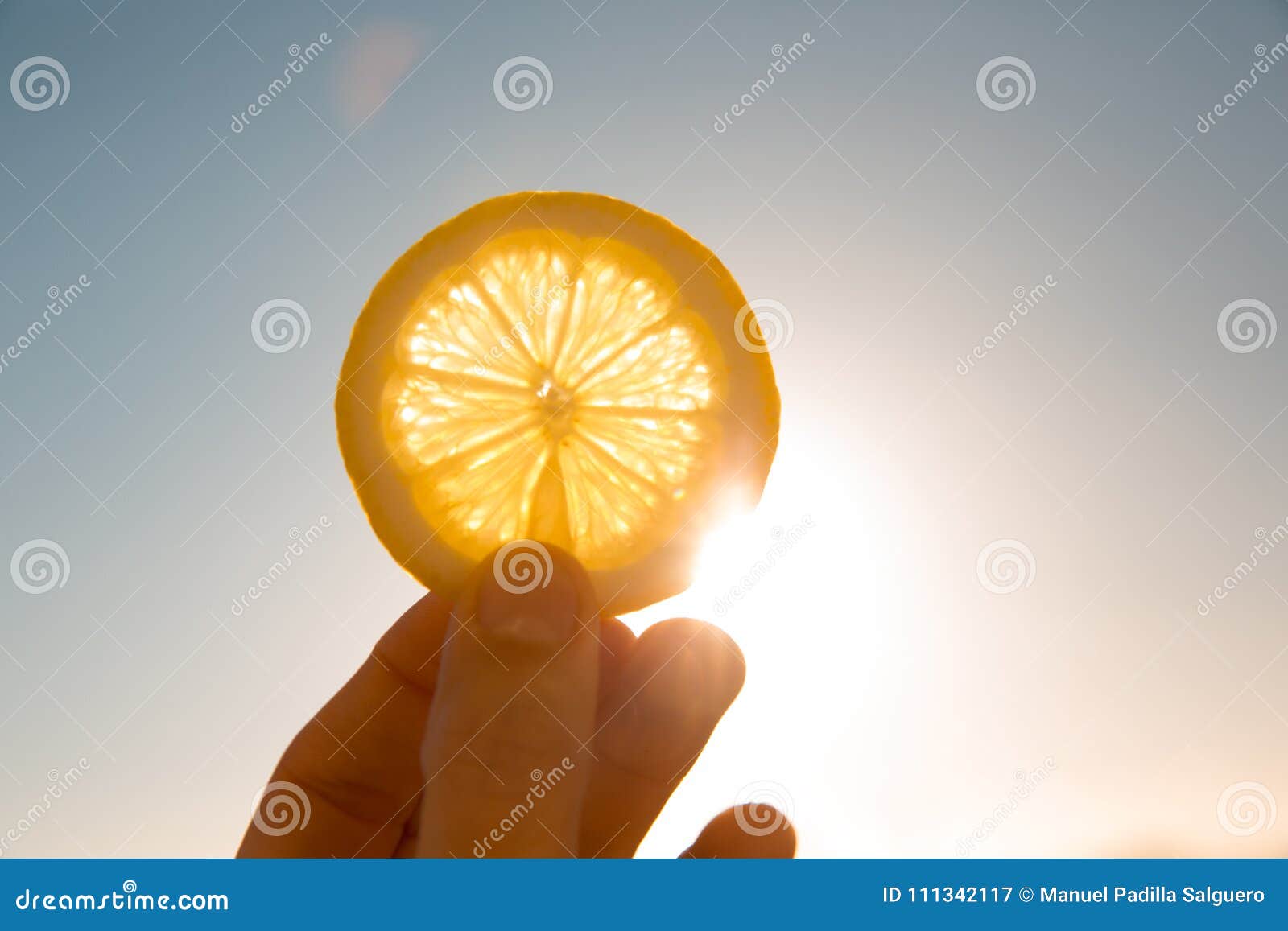 Sun behind lemon slice stock image. Image of wooden - 111342117