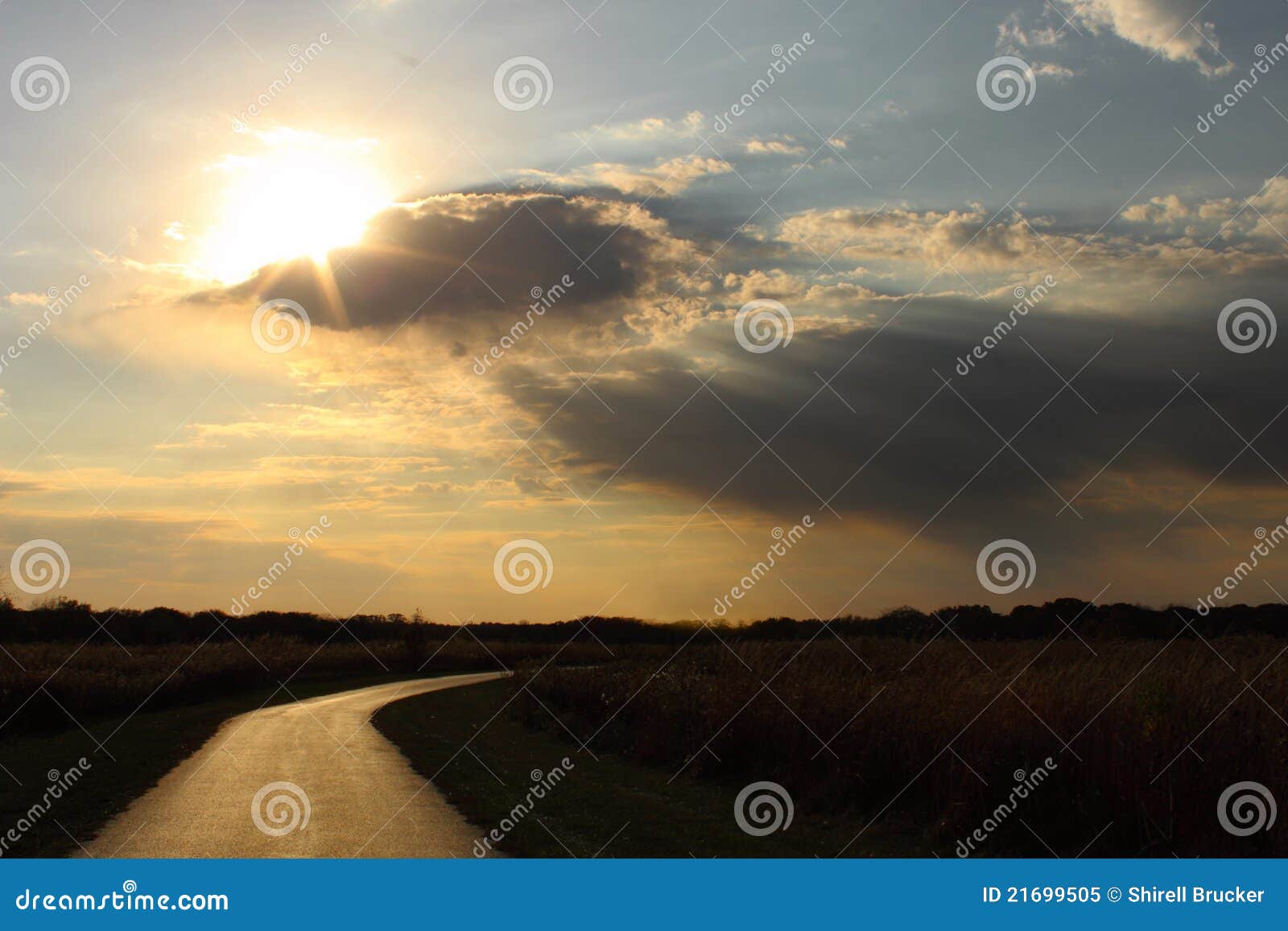 Sun Breaking through Clouds on a Lonely Road Stock Image - Image of ...