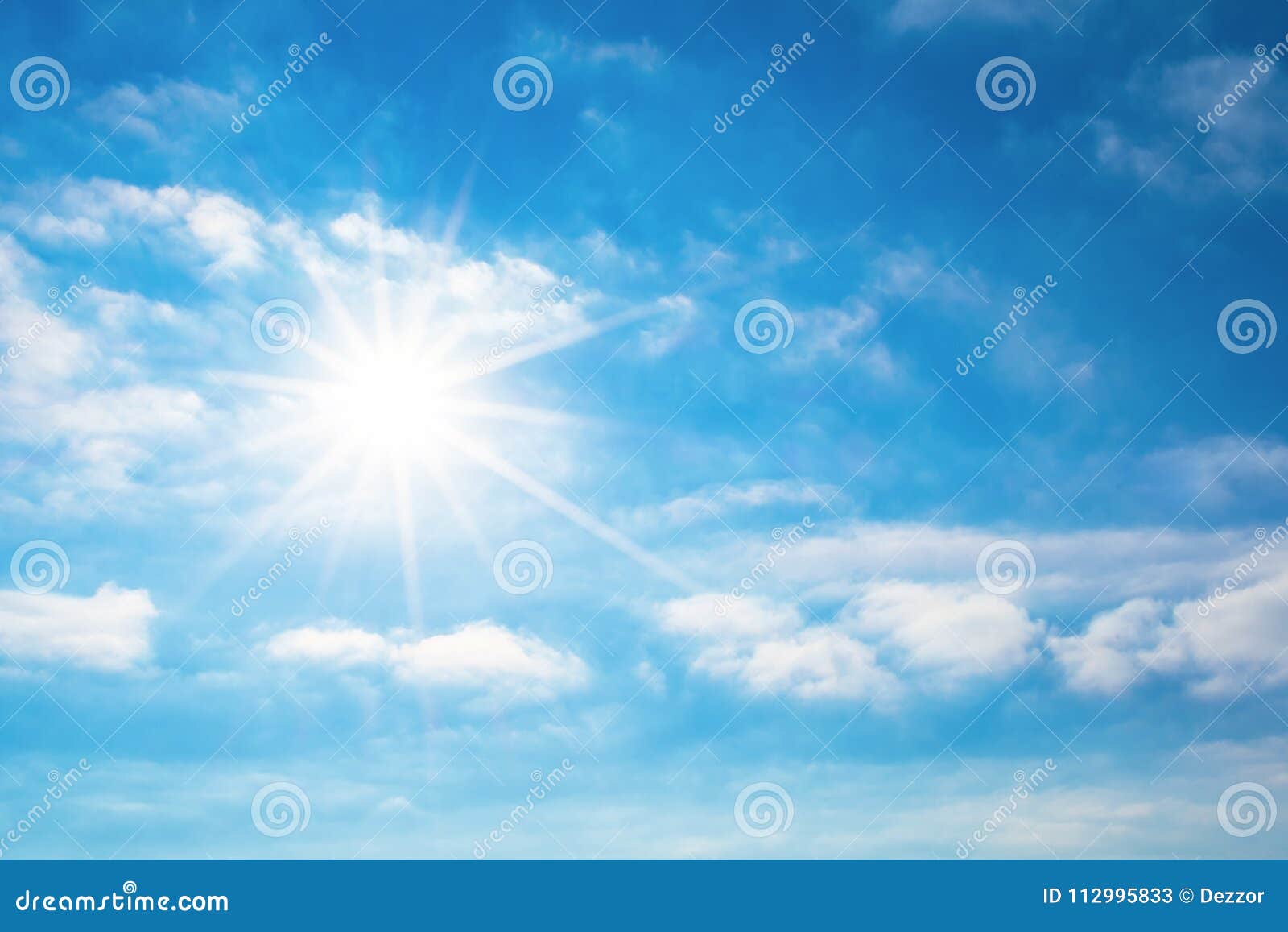 The Sun with Bright Rays in the Blue Sky with White Light Clouds Stock ...