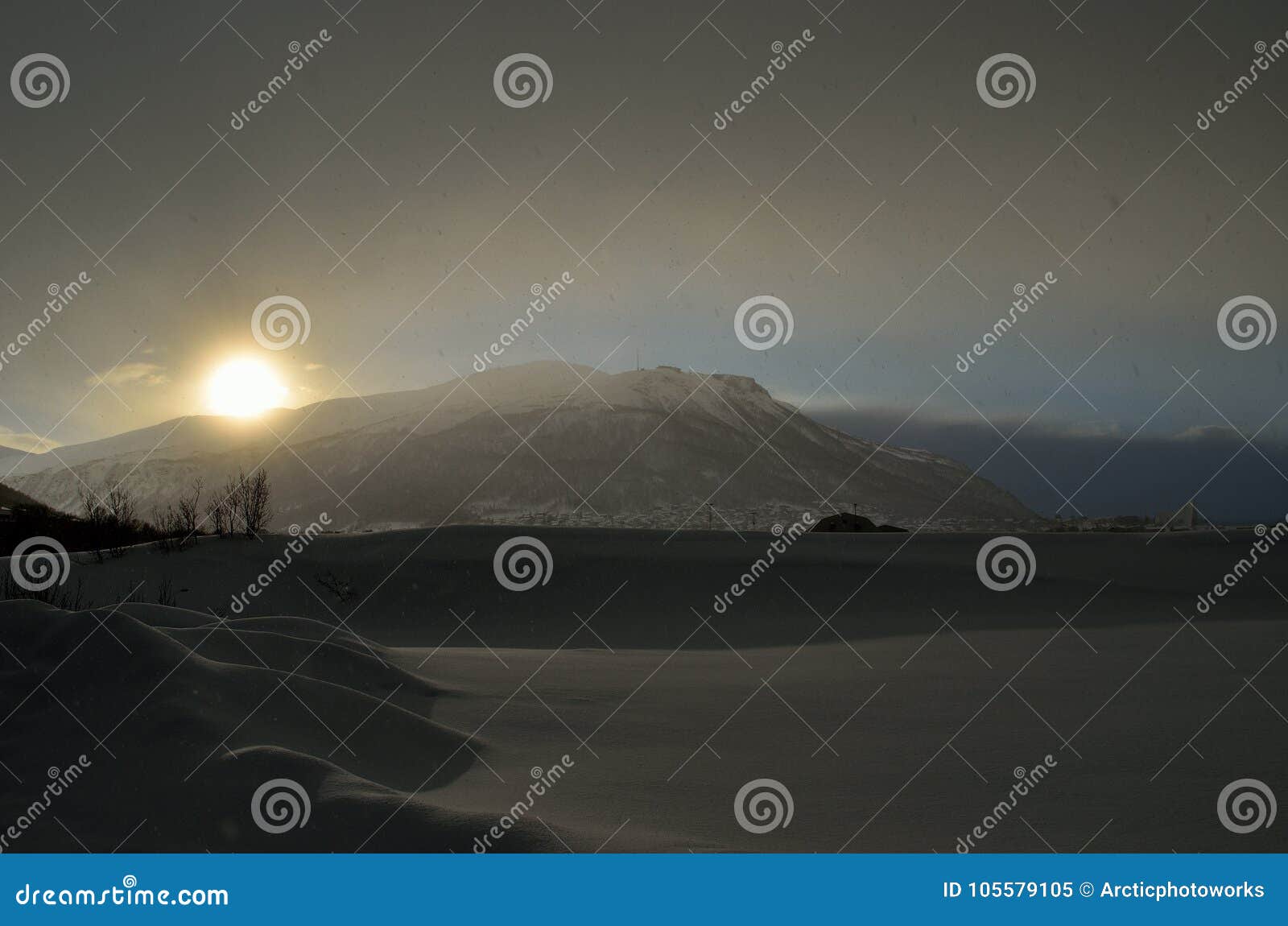Sun between Clouds Over Snowy Mountain As the Snow is Falling Down ...