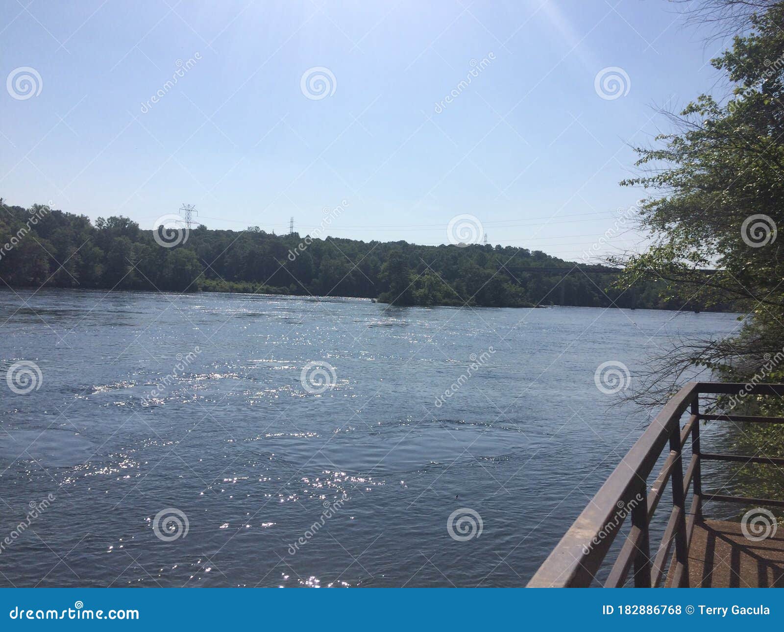 Sun Dappled Cold River stock photo. Image of reservoir - 182886768