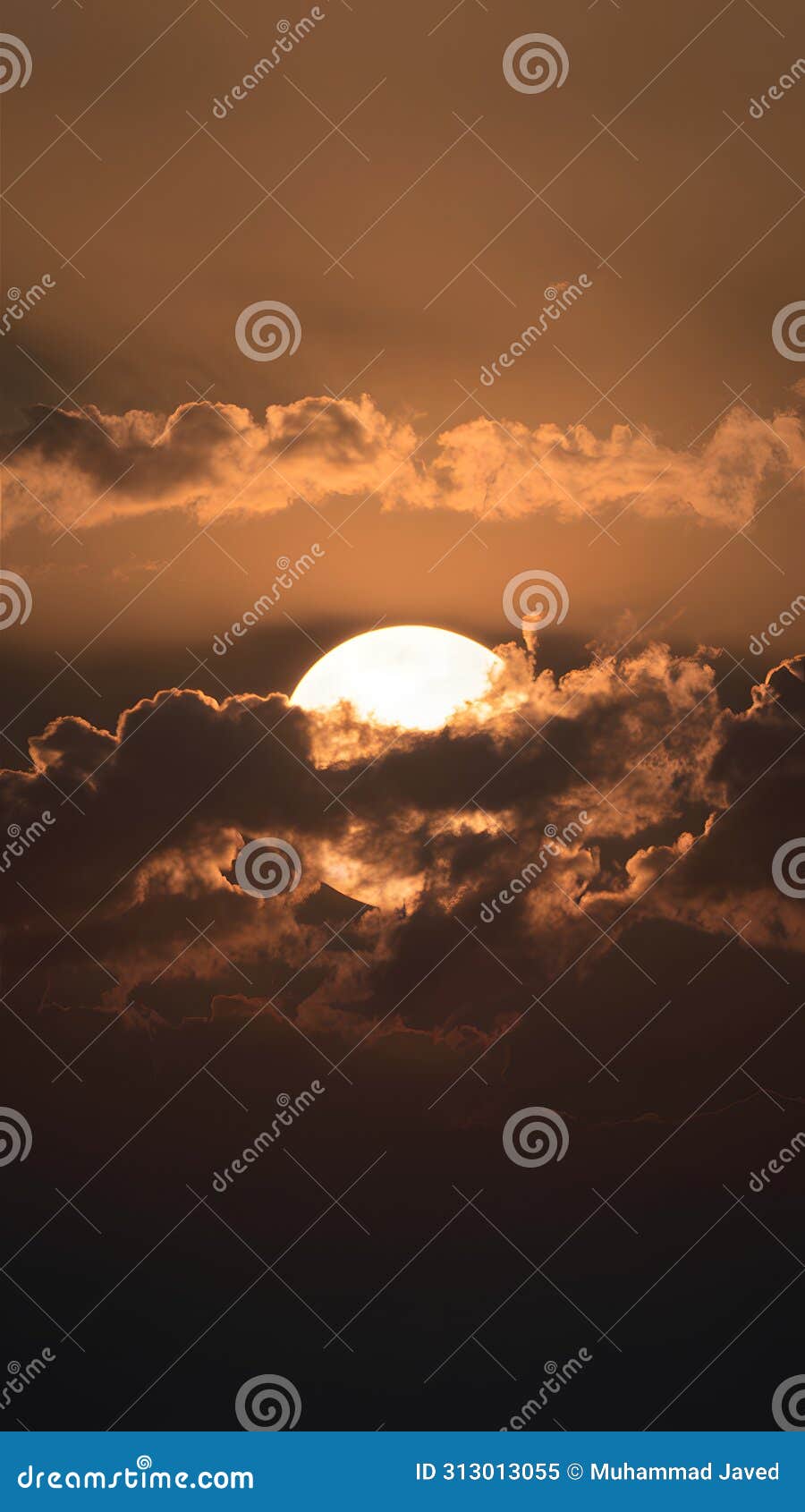 Sun Disk Peeks Out from Behind Dramatic Backlit Clouds Stock ...