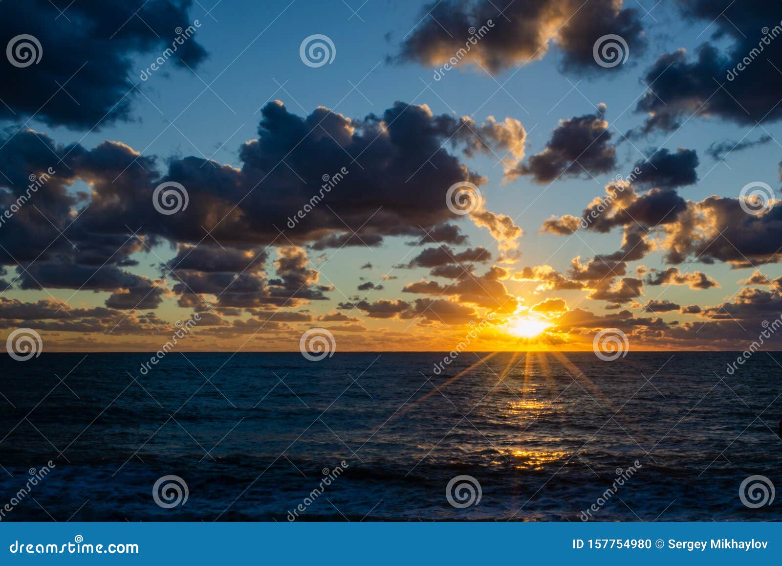 A sun disk with rays stock photo. Image of evening, seascape - 157754980