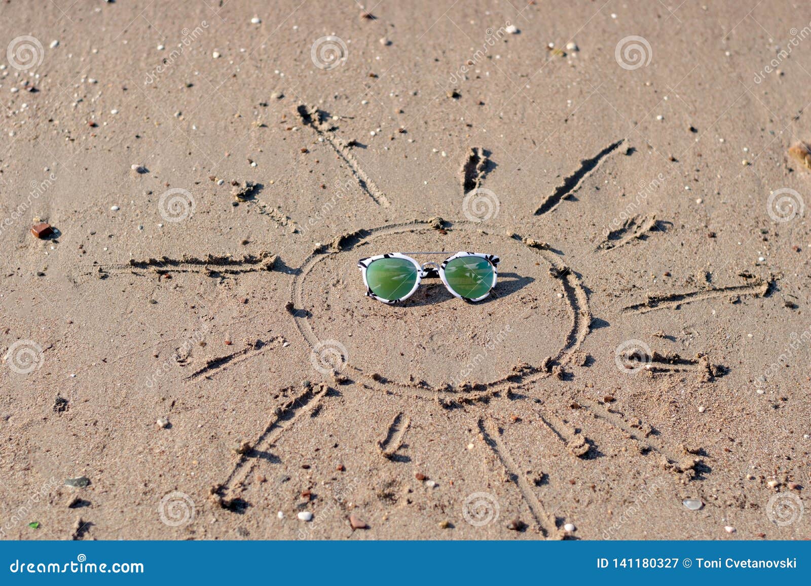 Sun drawing in the sand stock image. Image of horizontal - 141180327