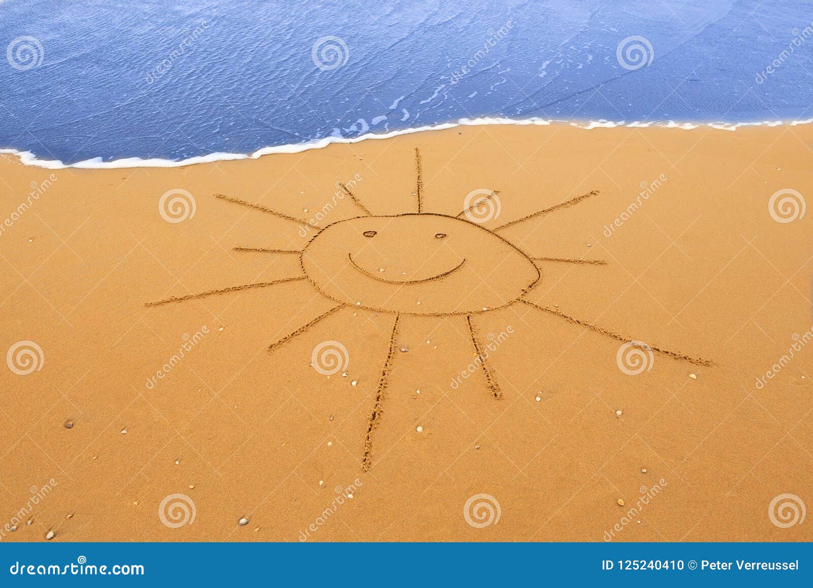 Sun drawn in the sand stock photo. Image of happyness - 125240410