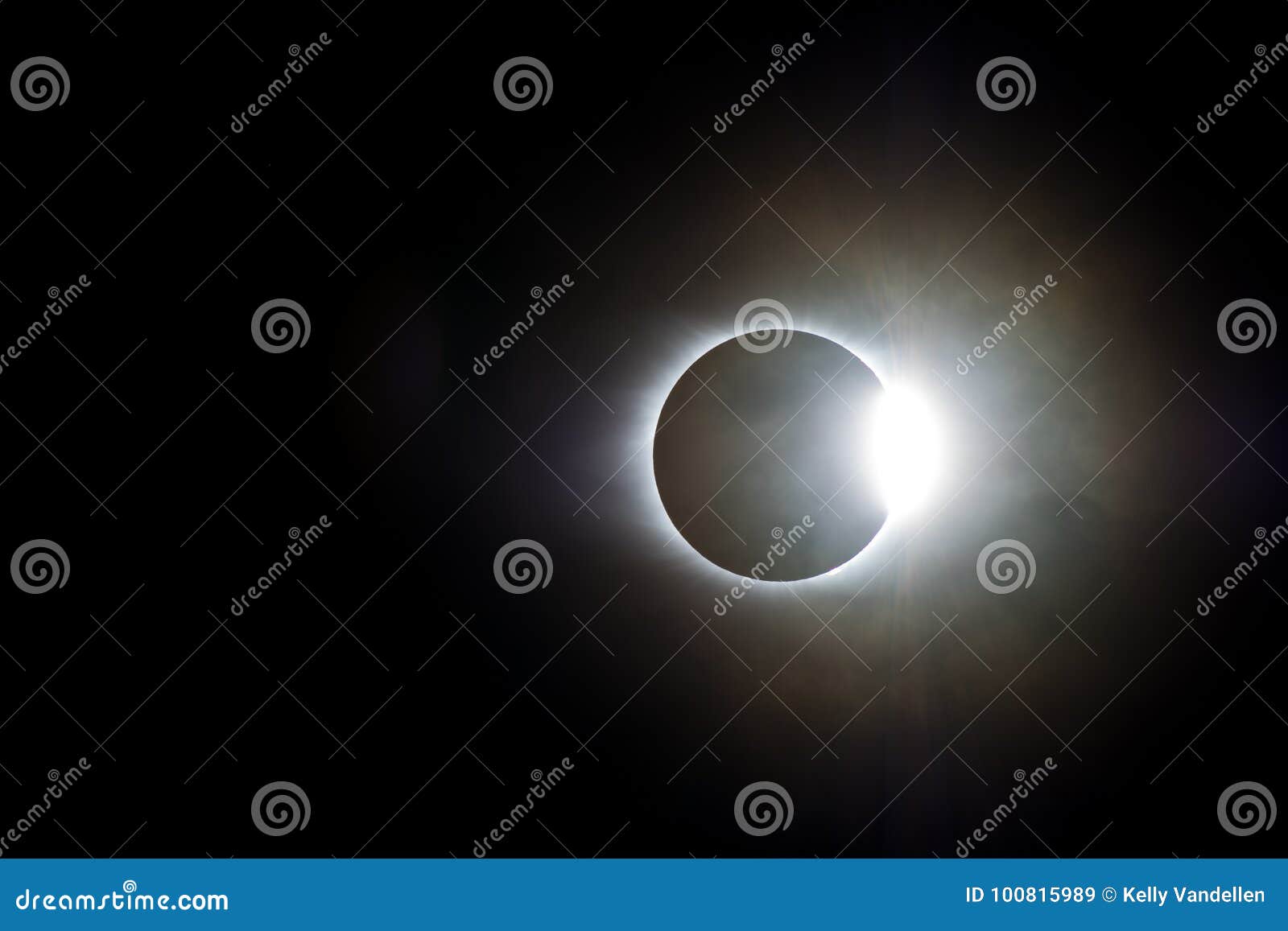 The Sun Emerges from Behind the Moon on a Cloudy Day Stock Image ...