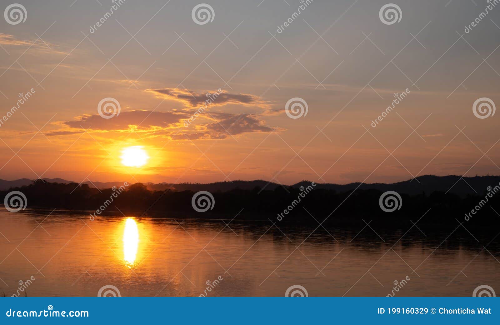 The Sun is Falling Behind the Mountain View the Beautiful River Stock ...