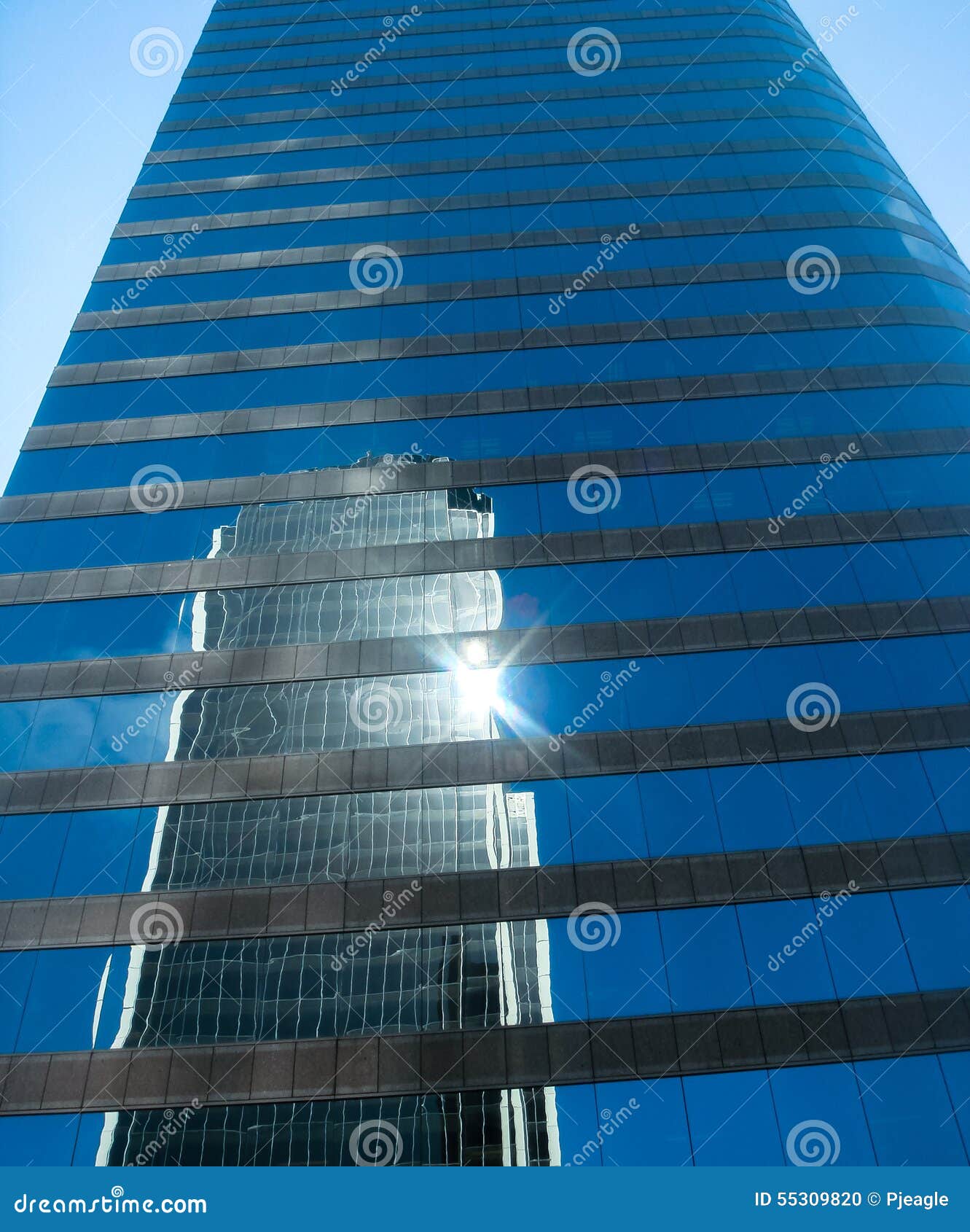 Sun Flair Reflection Off Glass Skyscraper Stock Photo - Image of flair ...