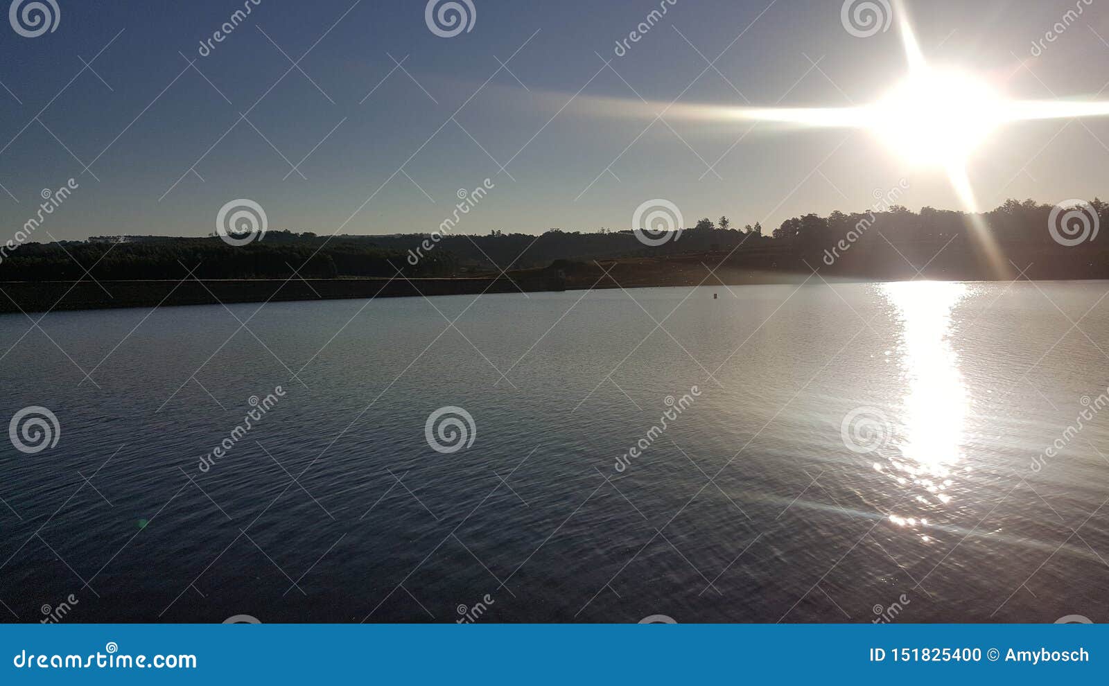 Sun gazing over dam stock photo. Image of sunset, gazing - 151825400