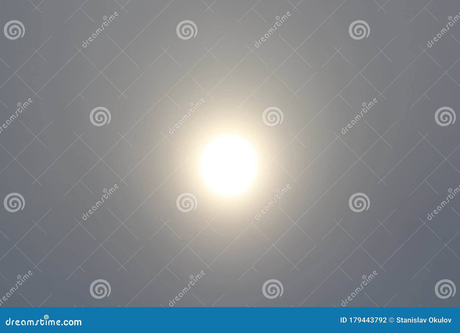 The Sun in the Haze Against the Blue Sky. Defocused Background for ...
