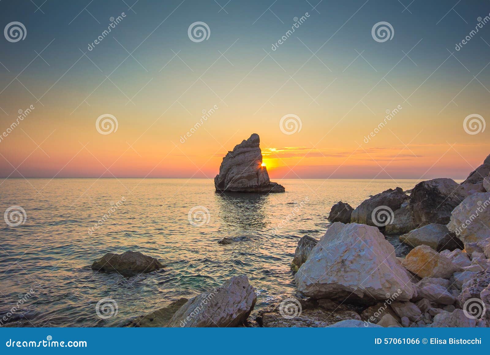 Sun hide behind the rock stock photo. Image of coast - 57061066