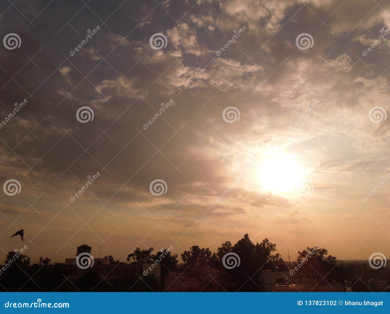 Sun hiding behind sky stock photo. Image of hiding, clouds - 137823102