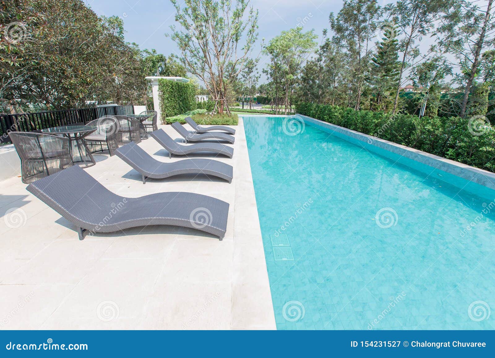 Sun Loungers and Beautiful Swimming Pool Stock Image - Image of chair ...