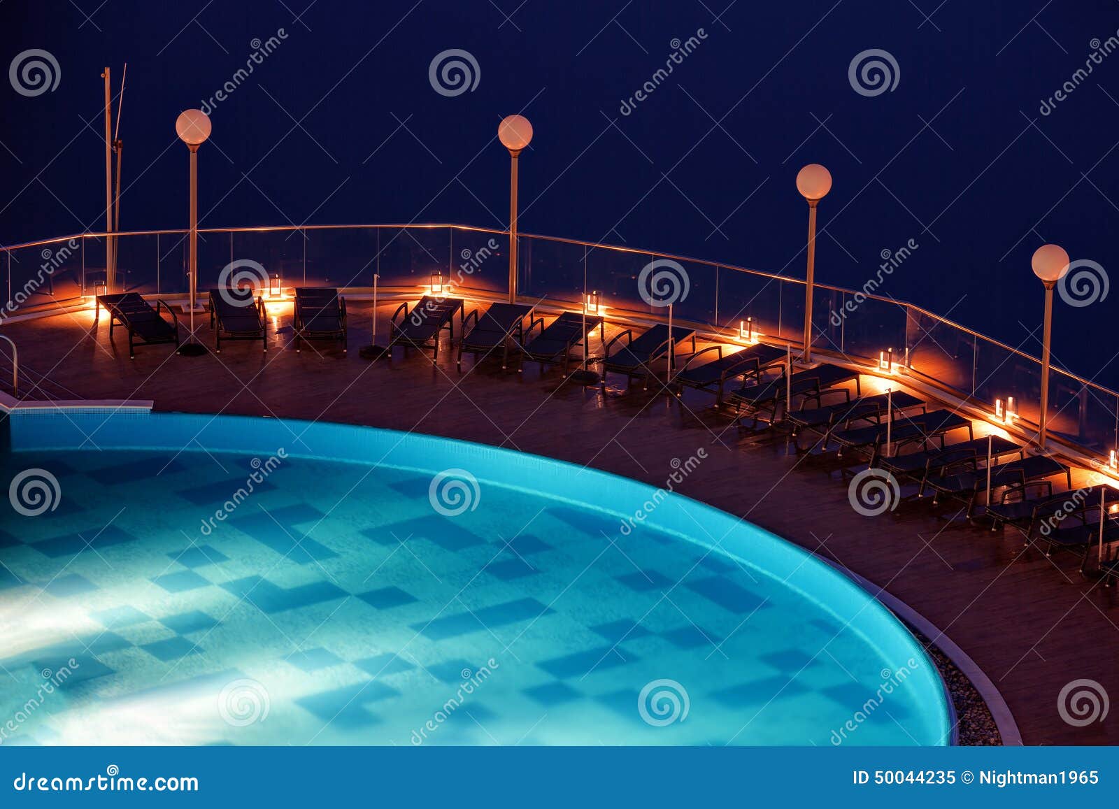 Sun loungers on poolside stock image. Image of summer - 50044235