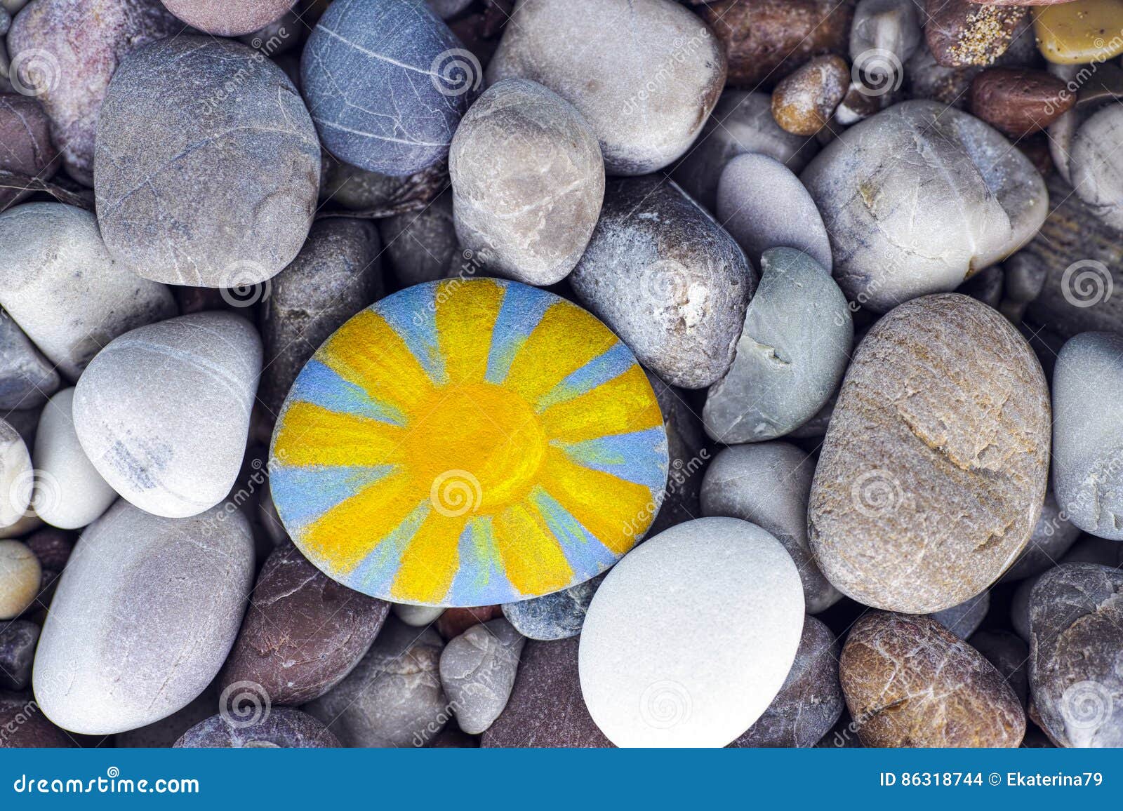 Sun Painted on Pebble with Stones Background Stock Photo - Image of ...