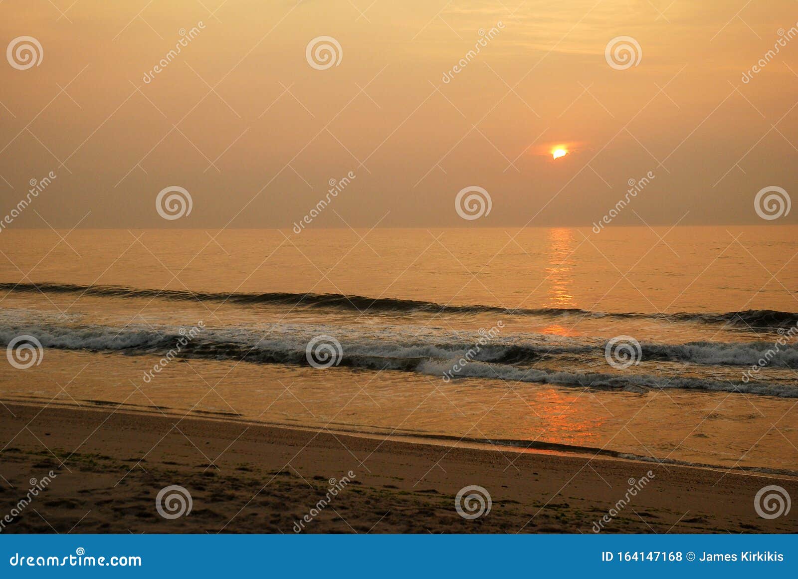 Sunrise on a hazy morning stock photo. Image of coastal - 164147168