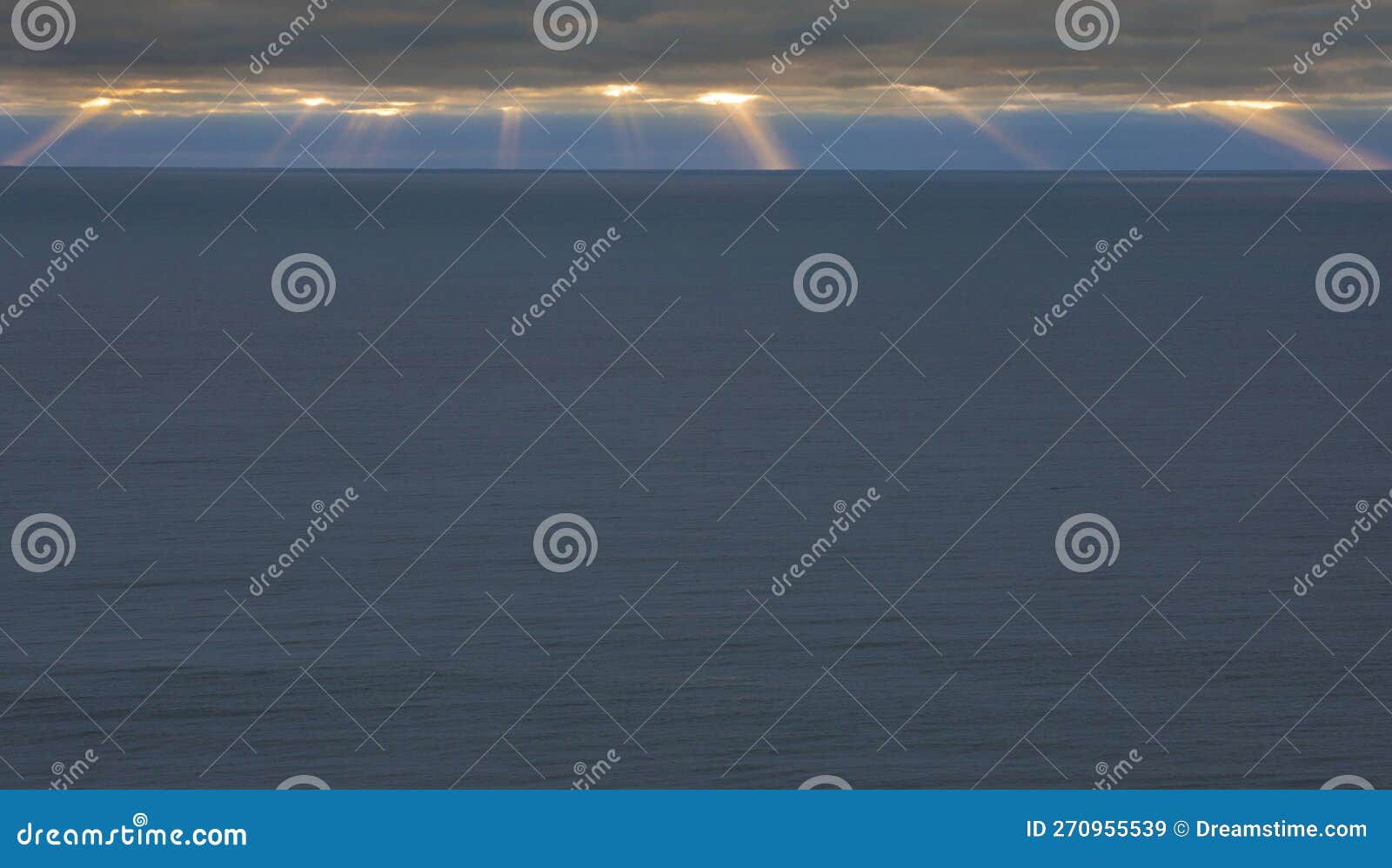 Sun Peeking through the Clouds Over the Atlantic Ocean Stock Image ...