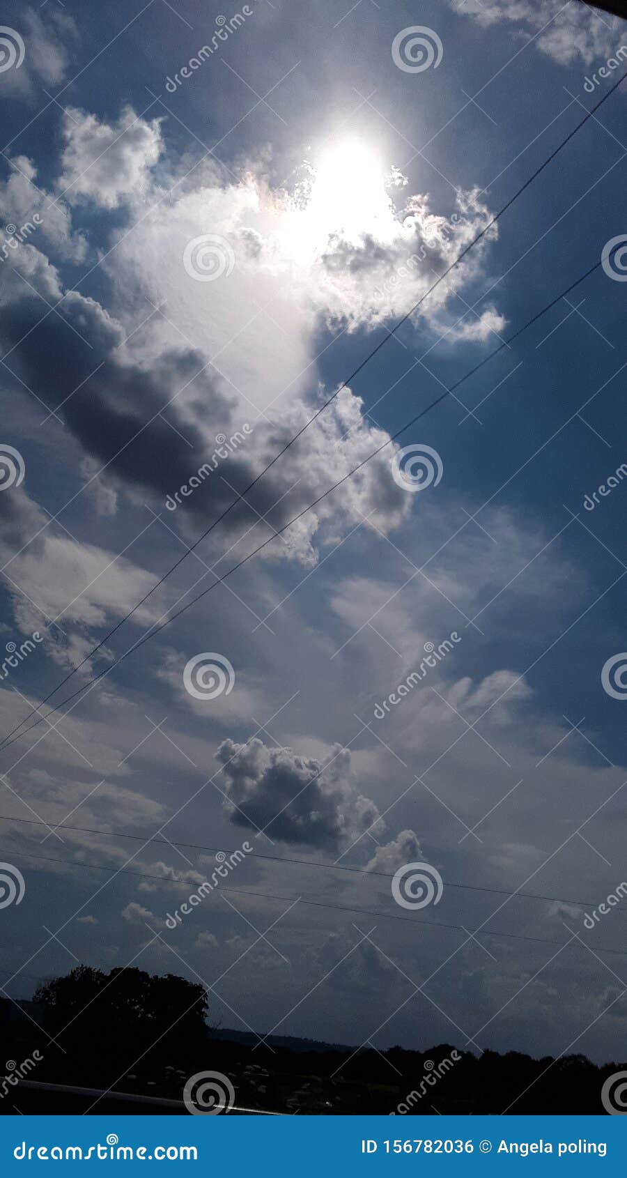Sun peeking through clouds stock photo. Image of clouds - 156782036