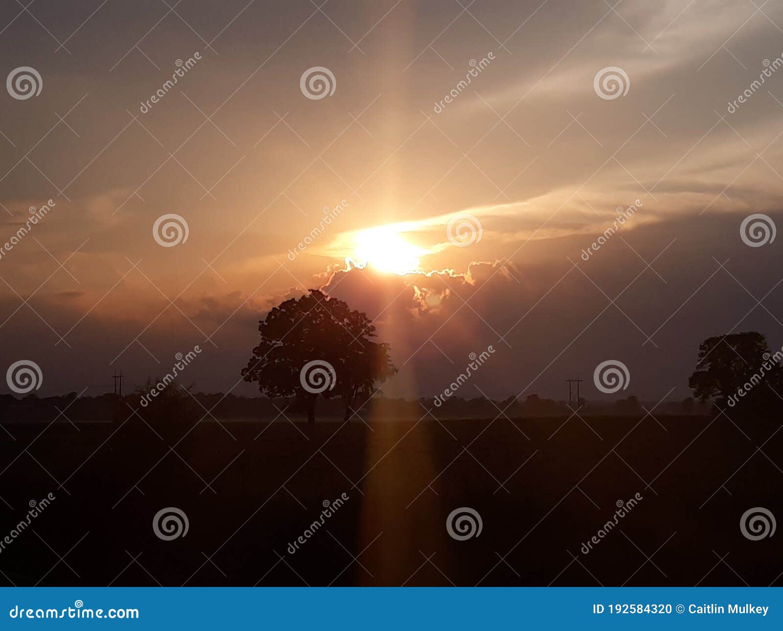 Sun Peeking through Clouds are Sunset Stock Photo - Image of dawn ...