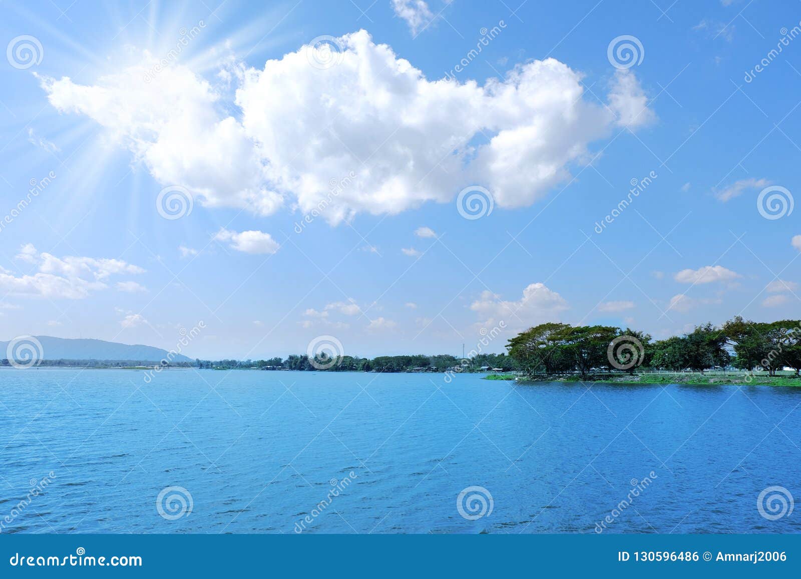Sun Ray Light on Blue Sky Over Big Lake Background. Stock Photo - Image ...