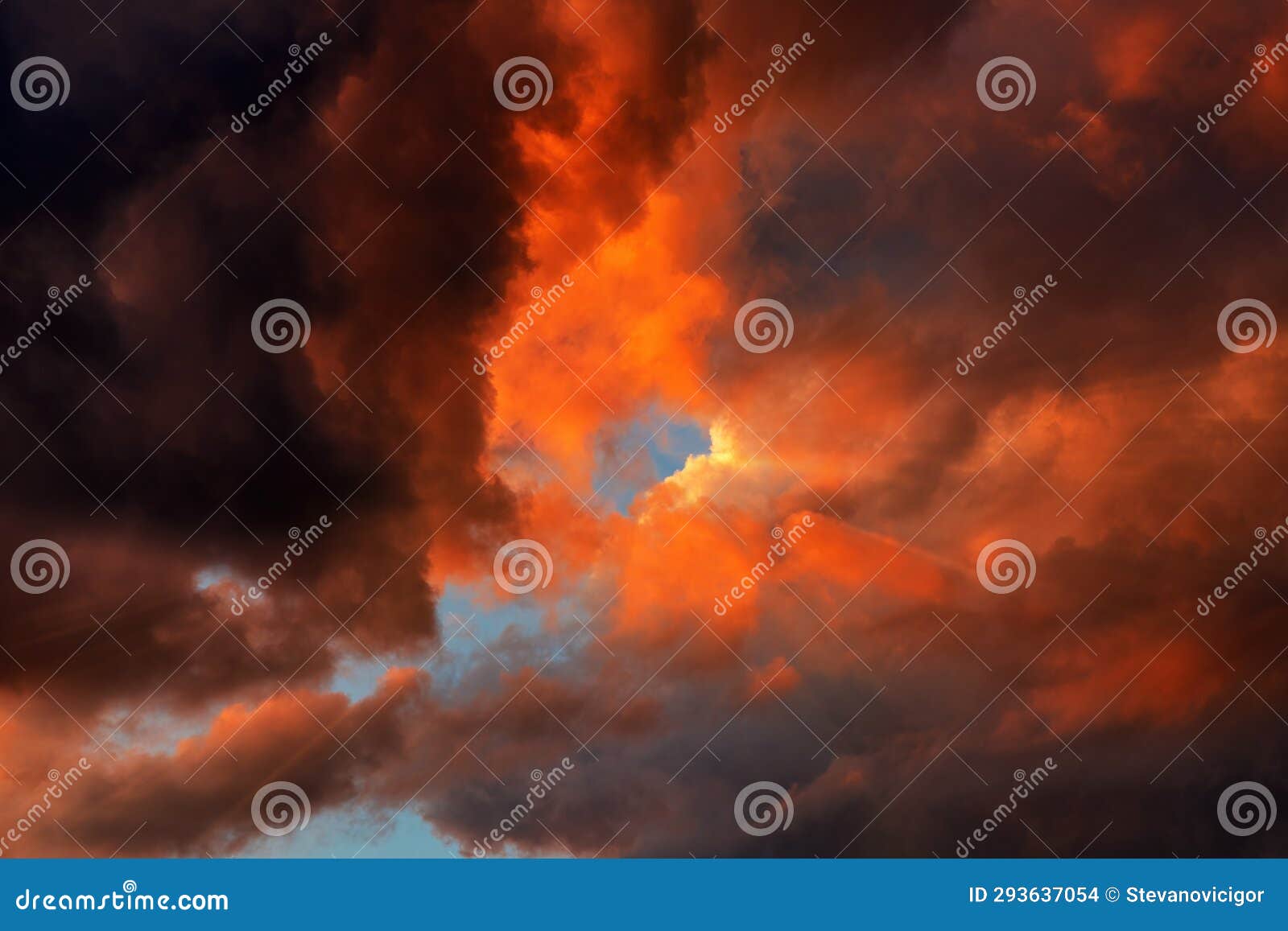 Sun Rays Beaming through Moody Clouds at Dramatic Sky in Summer Sunset ...
