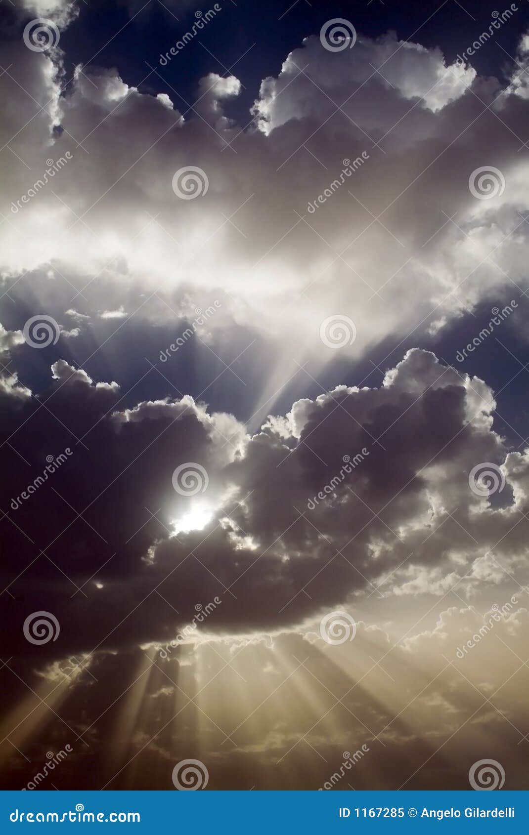 Sun rays behind clouds stock image. Image of storm, light - 1167285