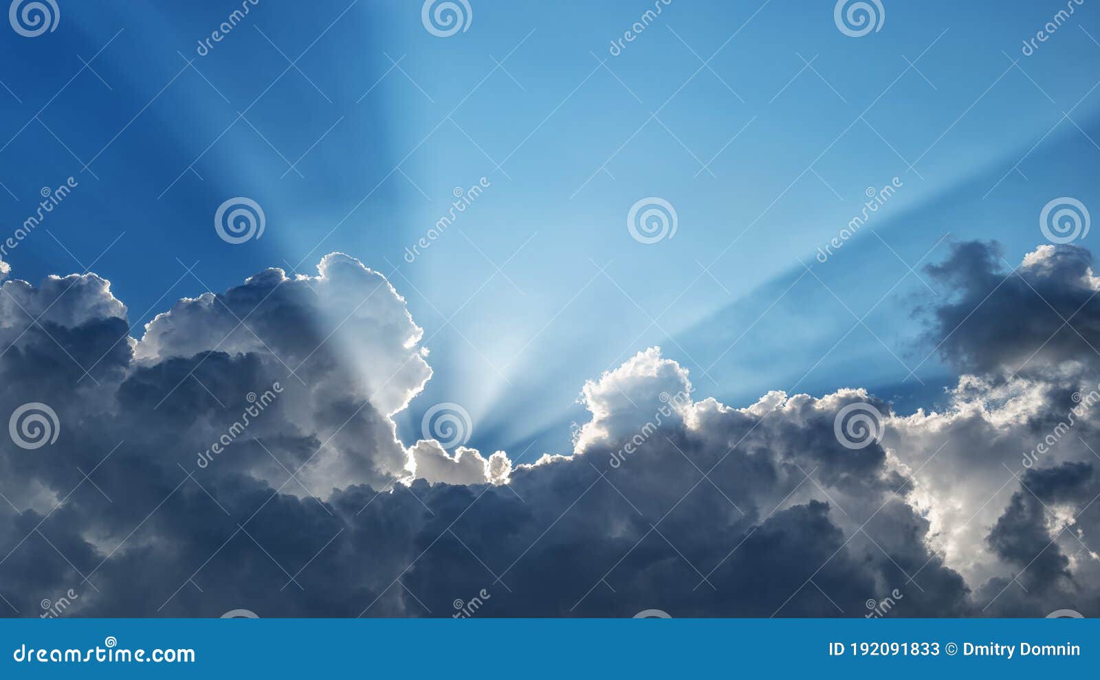 Sun Rays Behind Dark Clouds in a Blue Sky Stock Image - Image of ...