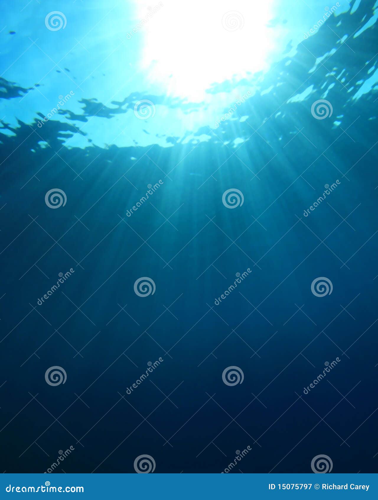 Sun rays in blue water stock image. Image of bright, beam - 15075797