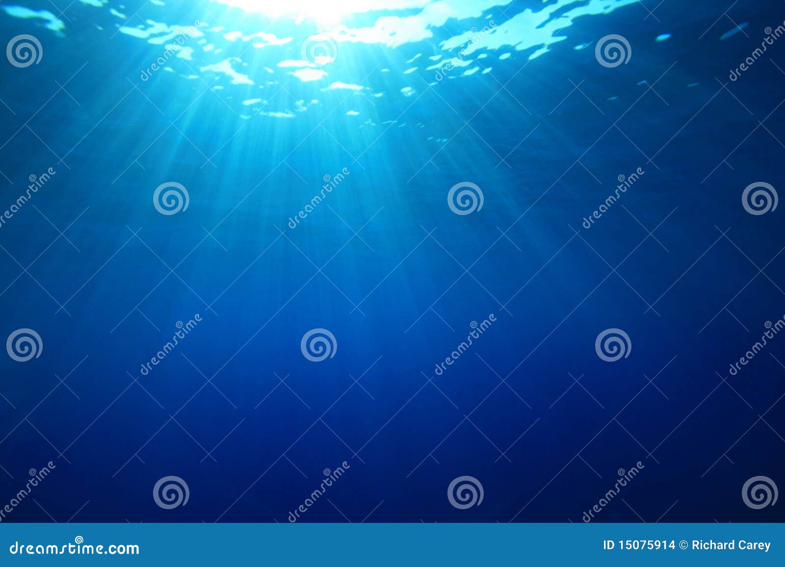 Sun rays in blue water stock photo. Image of texture - 15075914