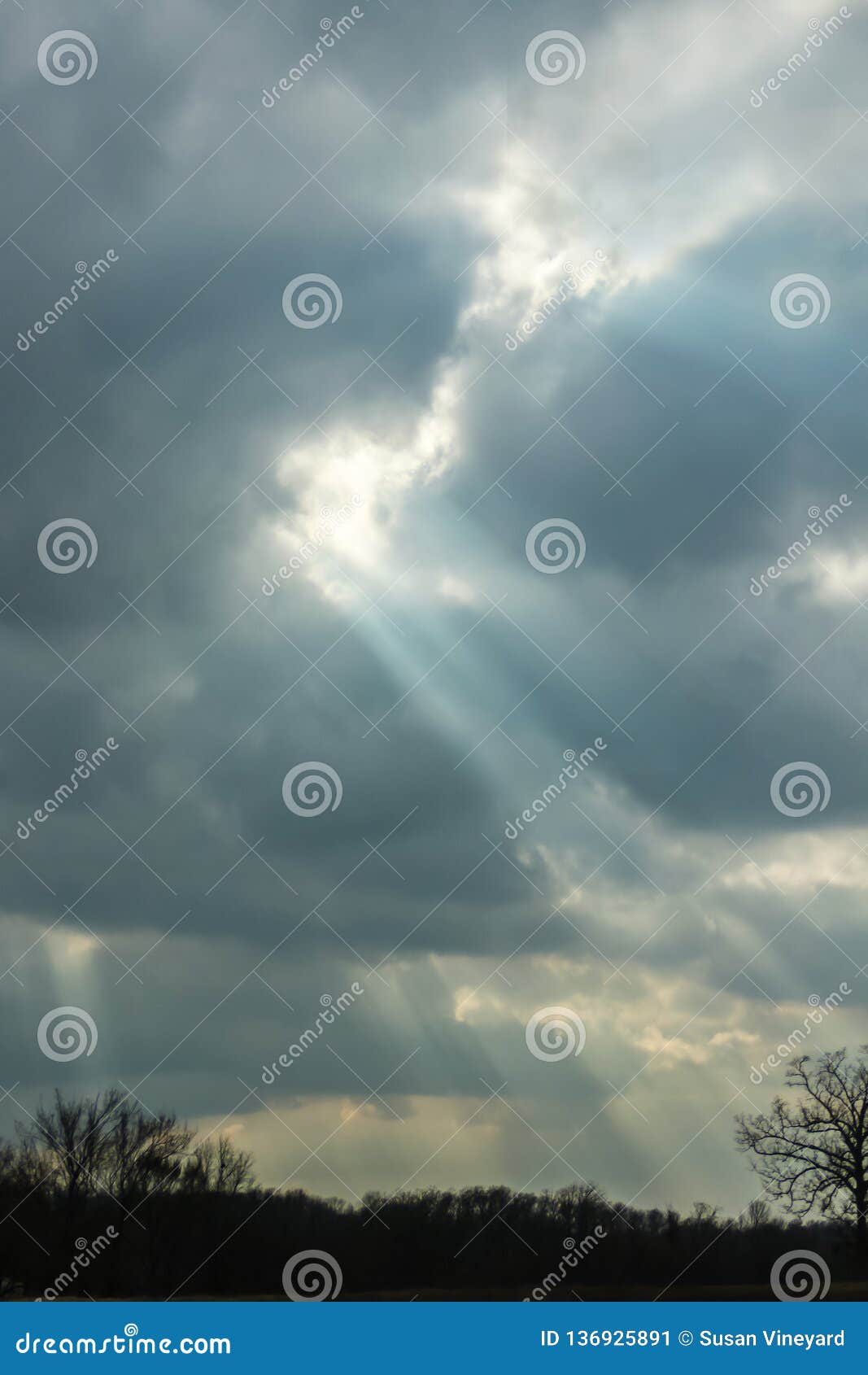 Sun Rays Breaking through the Clouds on a Stormy Winter Day at Dusk ...