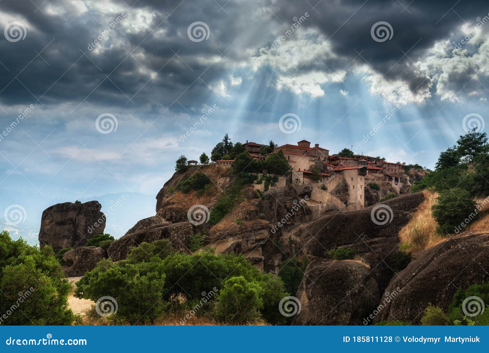 Sun Rays Breaking through the Dark Clouds Illuminate the Monastery on a ...