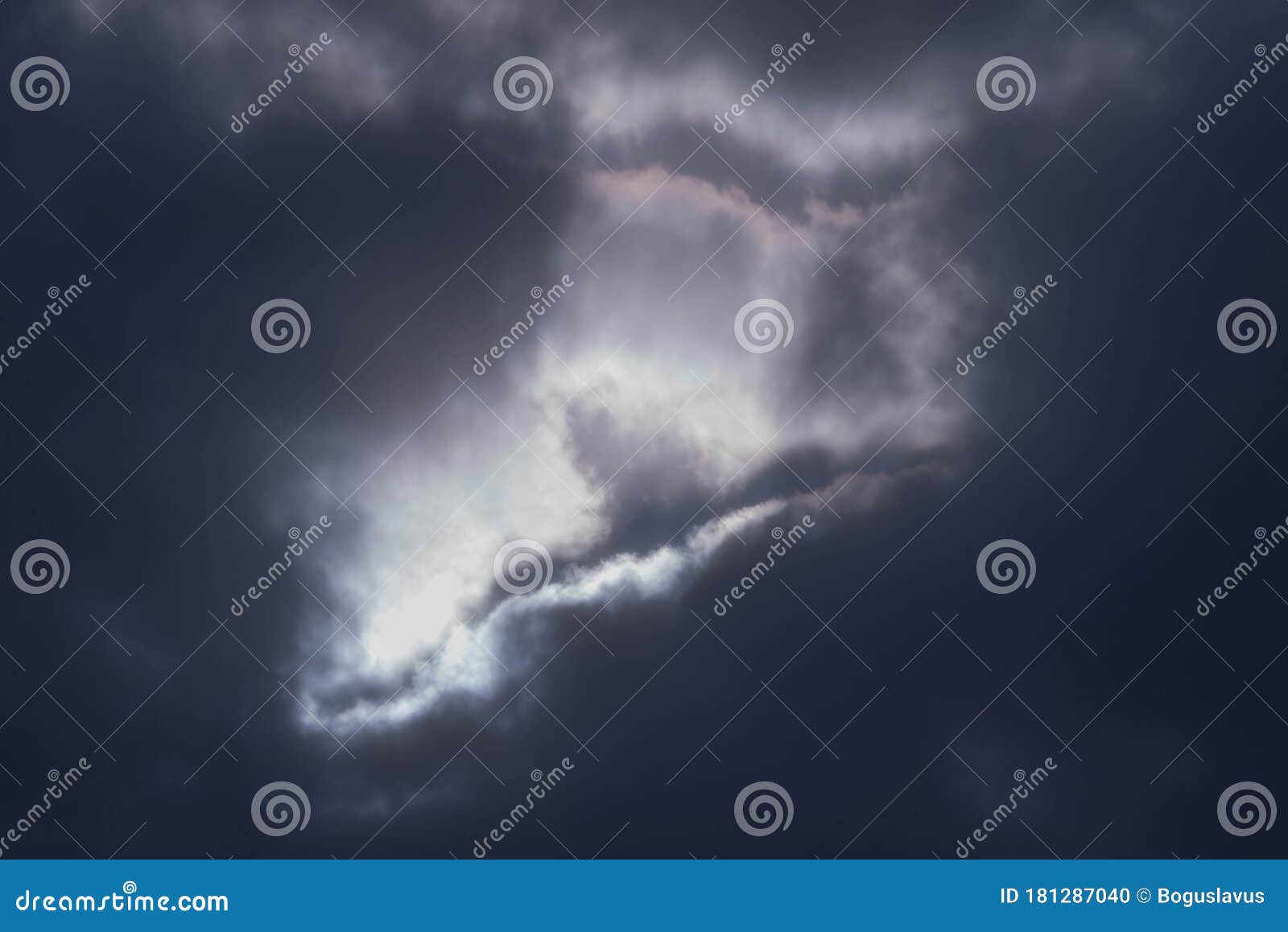 Sun Rays Breaking through the Layer of Dark Clouds. Stock Photo - Image ...