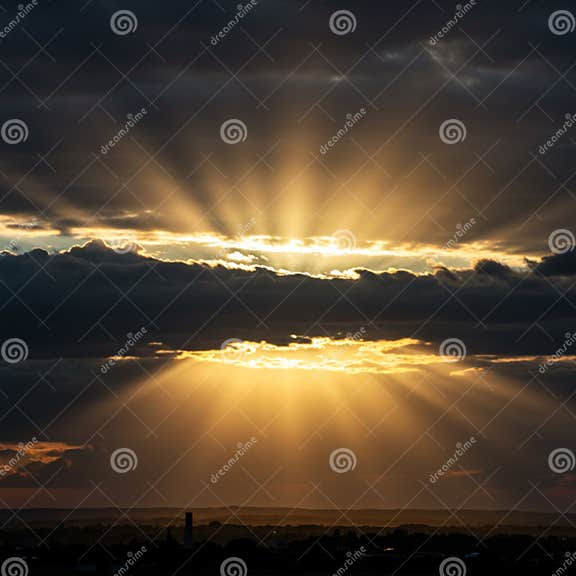 Sun Rays Burst through a Dense Layer of Dark Clouds, Creating a ...