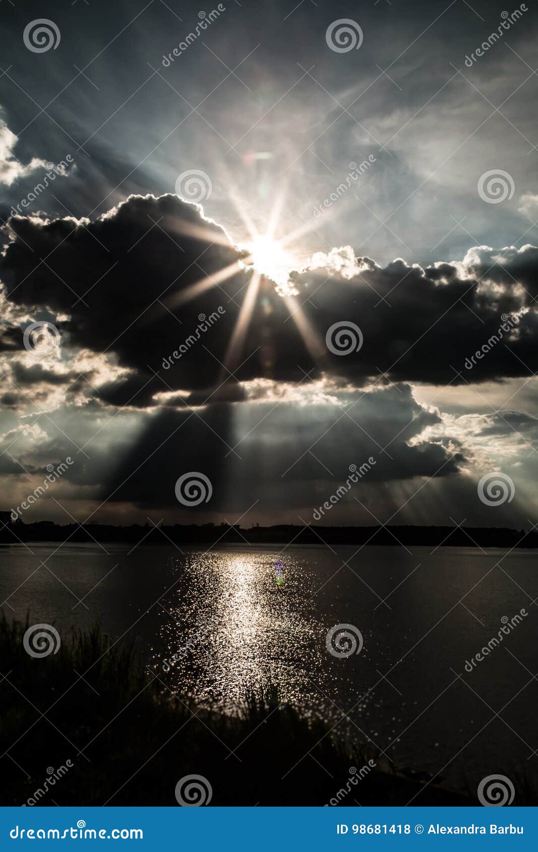 Sun Rays Behind Clouds Above the Lake Stock Photo - Image of lake ...