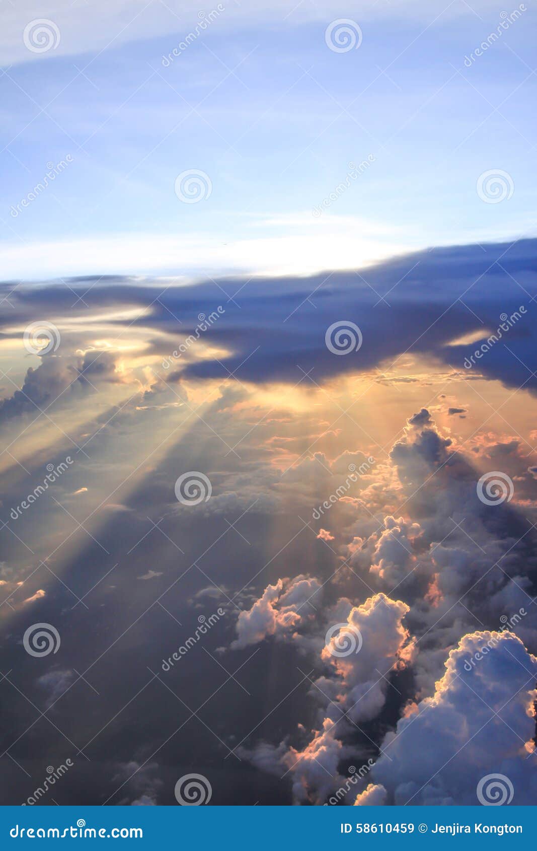 Sun rays through clouds stock image. Image of light, clouds - 58610459