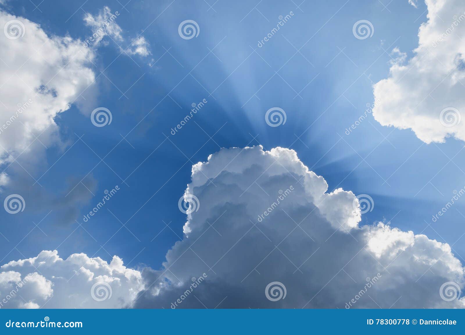 Sun Rays through the Clouds. Blue Sky with Sun Rays. Stock Photo ...
