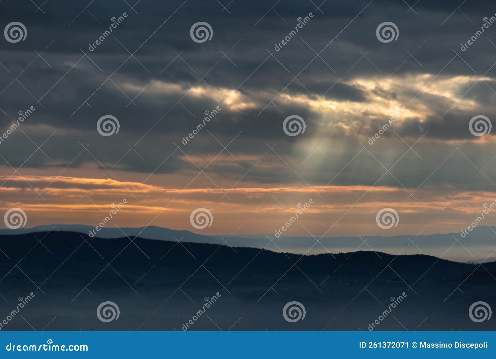 Sun Rays Coming Down from Some Clouds Above Mountains Stock Image ...