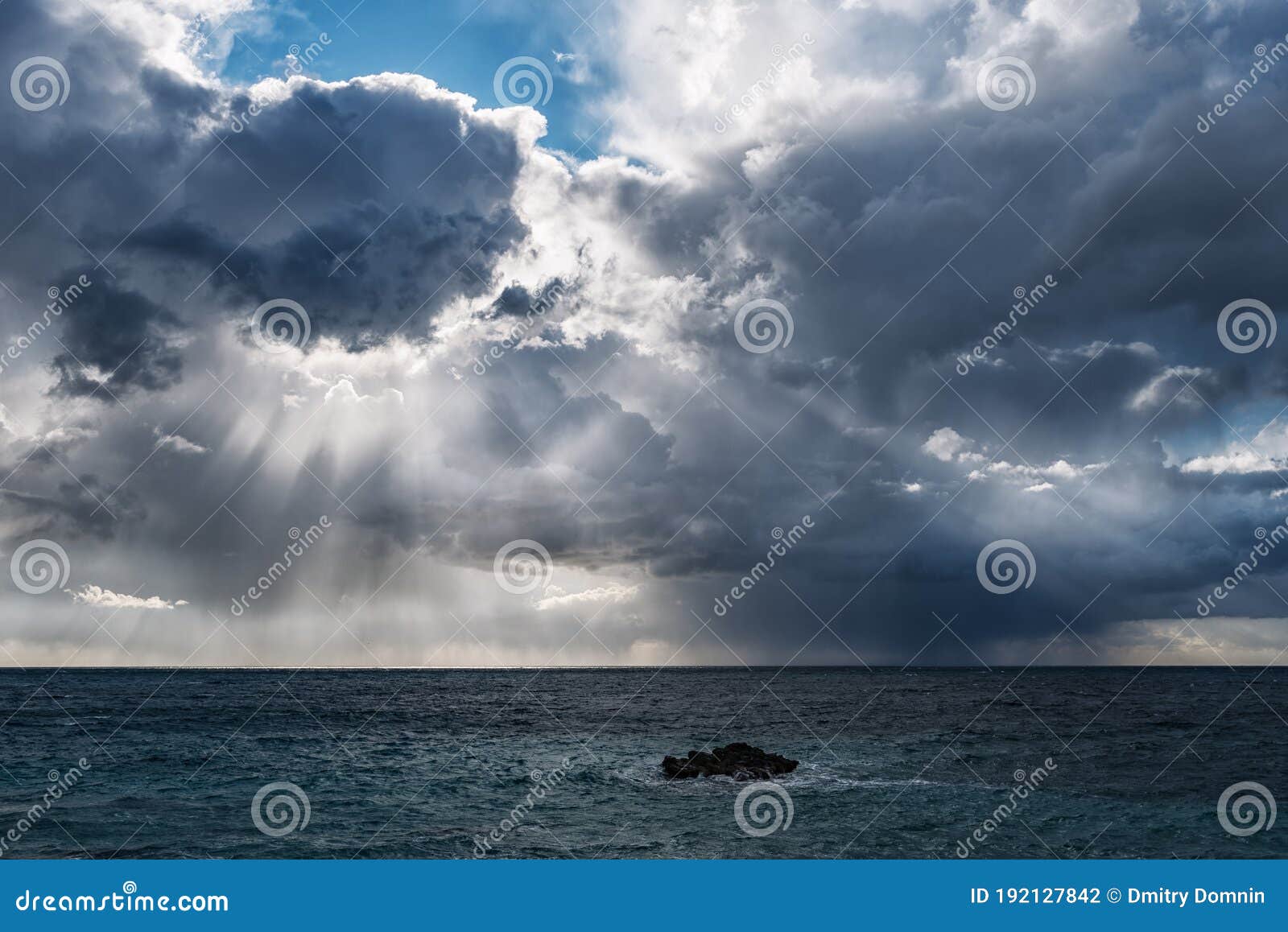 Dark Rain Clouds Over Water