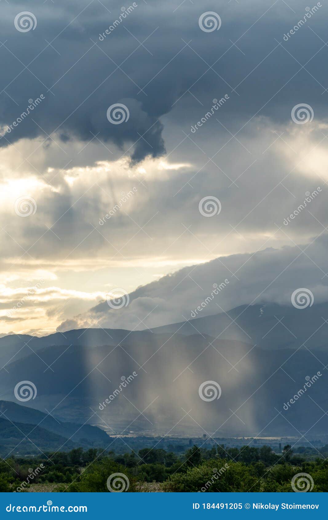 Sun Rays Lighting the Ground through the Clouds Stock Image - Image of ...