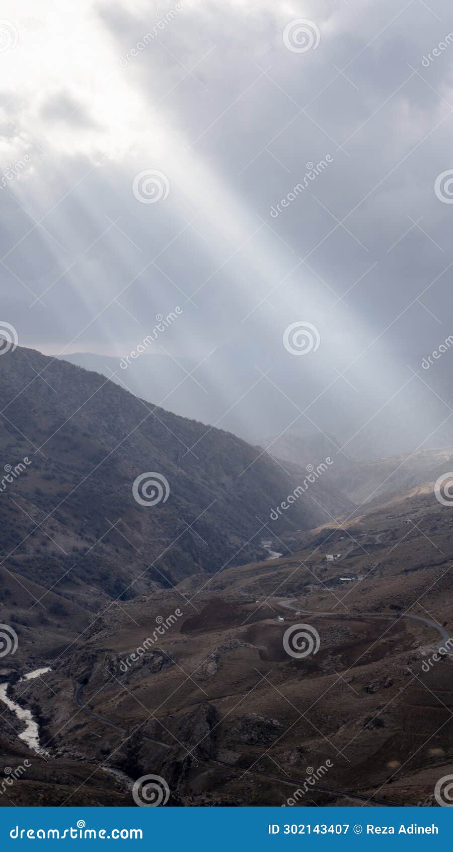 Sun Rays Passing through the Clouds Over the Valley Stock Image - Image ...