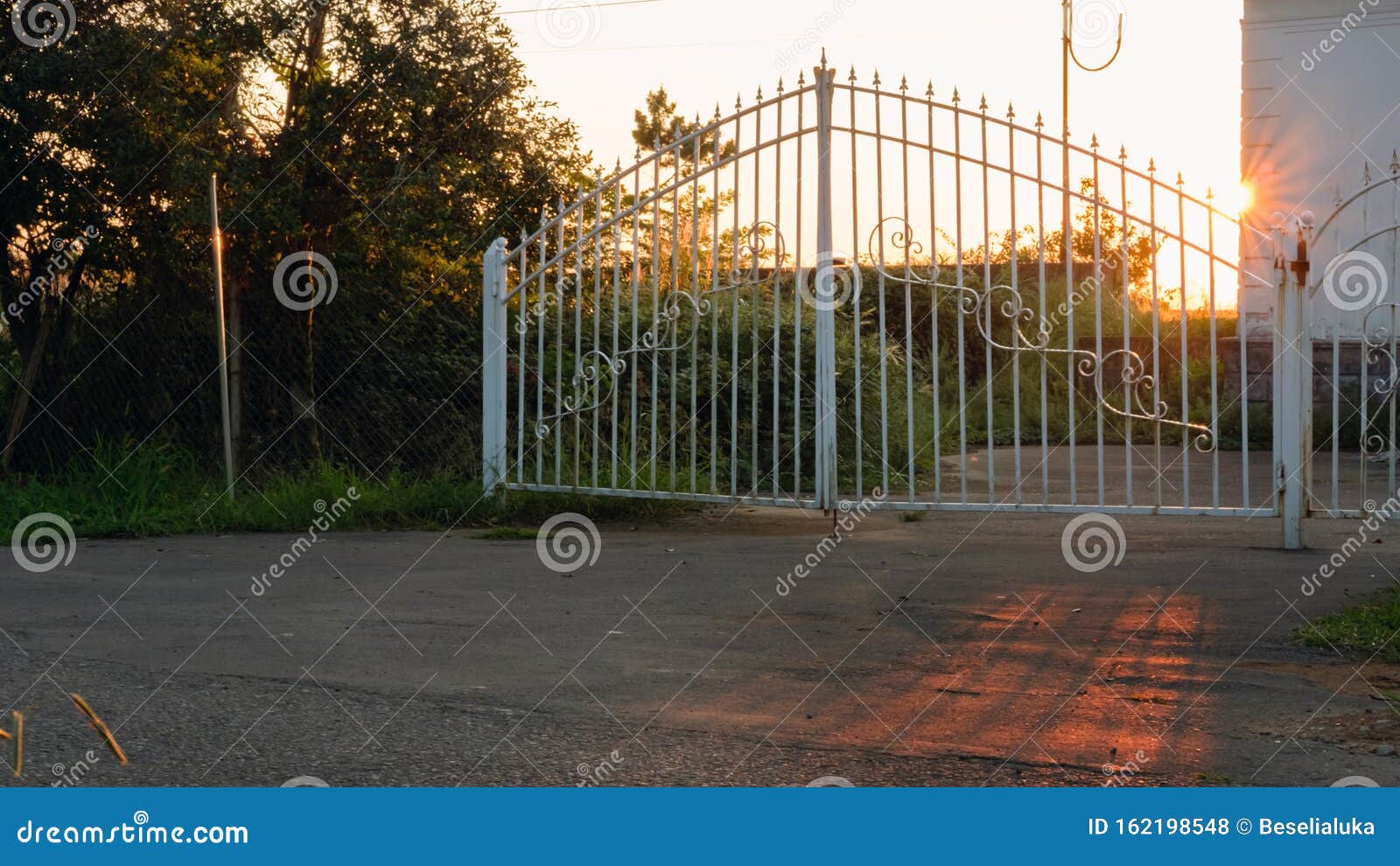 Sun Rays through the White Gate Stock Photo - Image of park, gate ...
