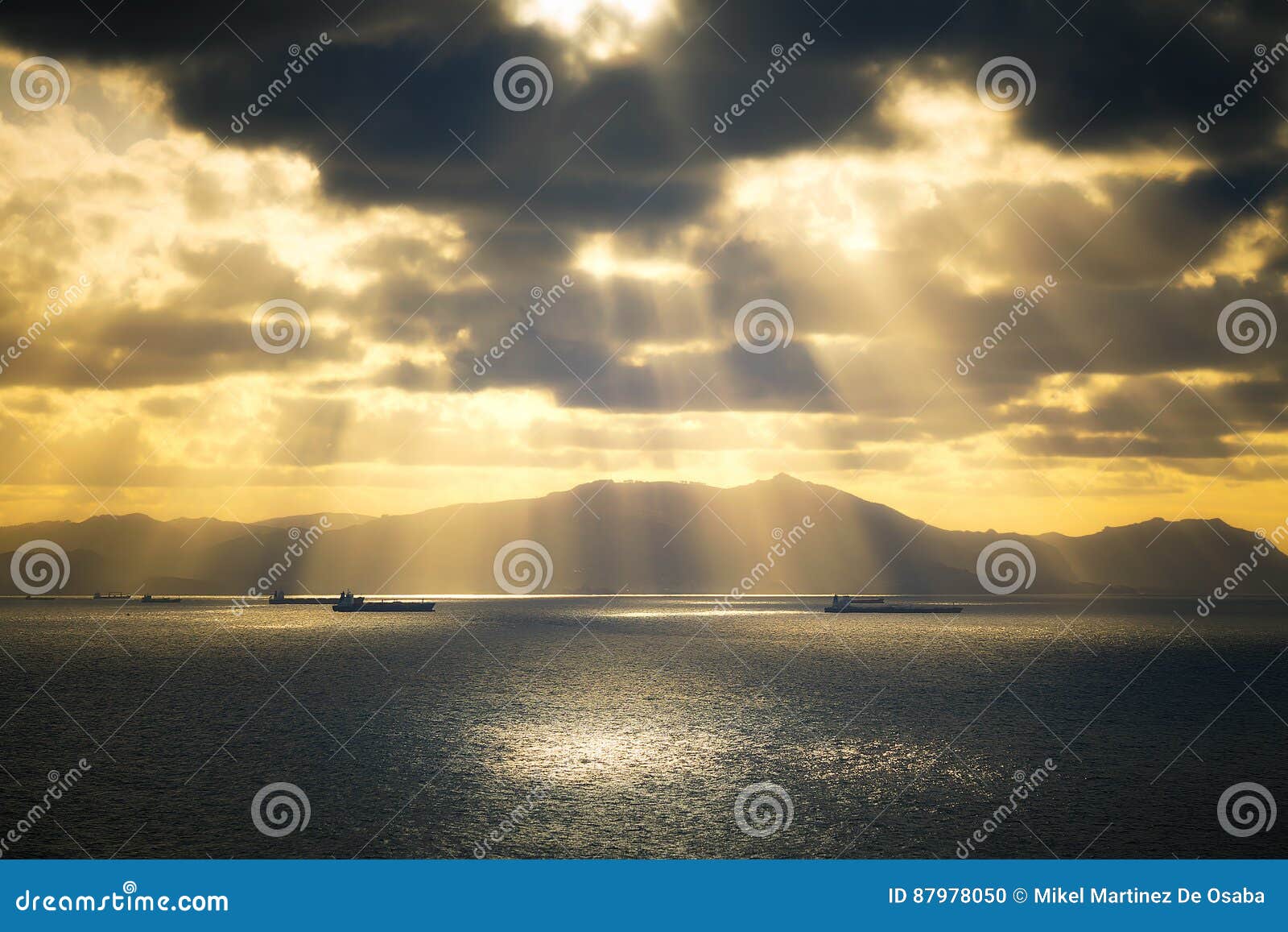 Sun rays on sea with ships stock photo. Image of container - 87978050