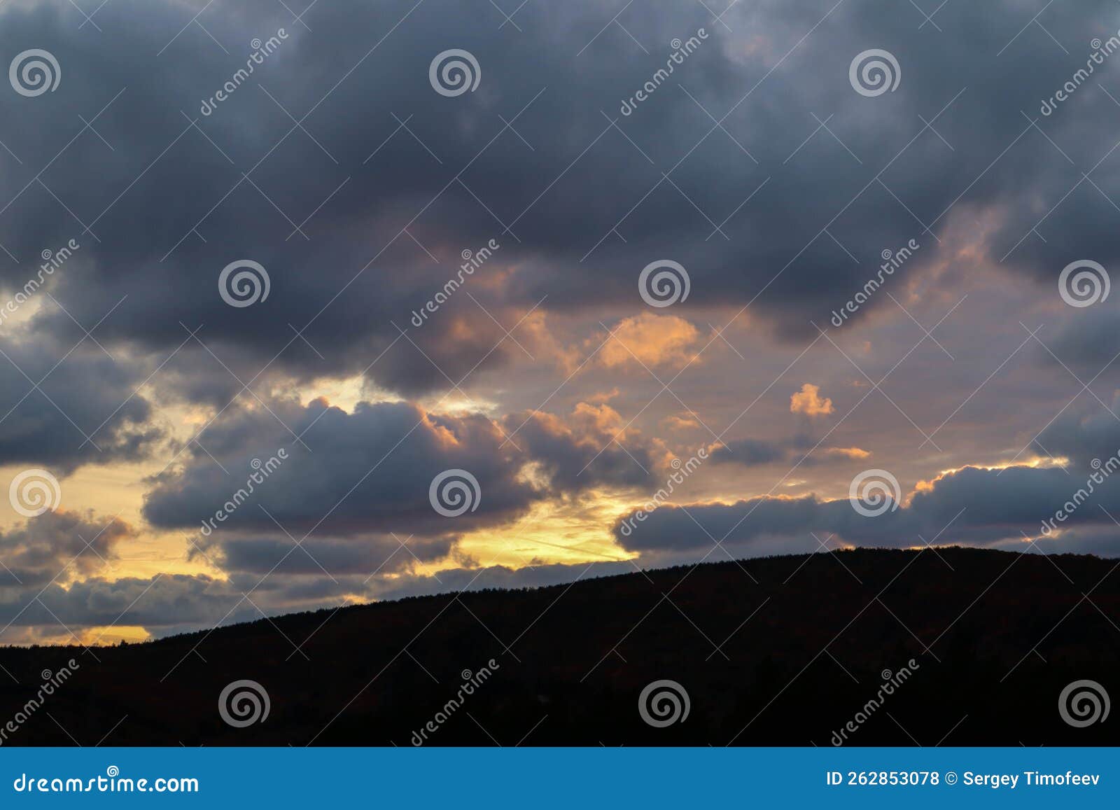 The Sun Rays Shine through the Clouds on the Sea Surface Stock Photo ...