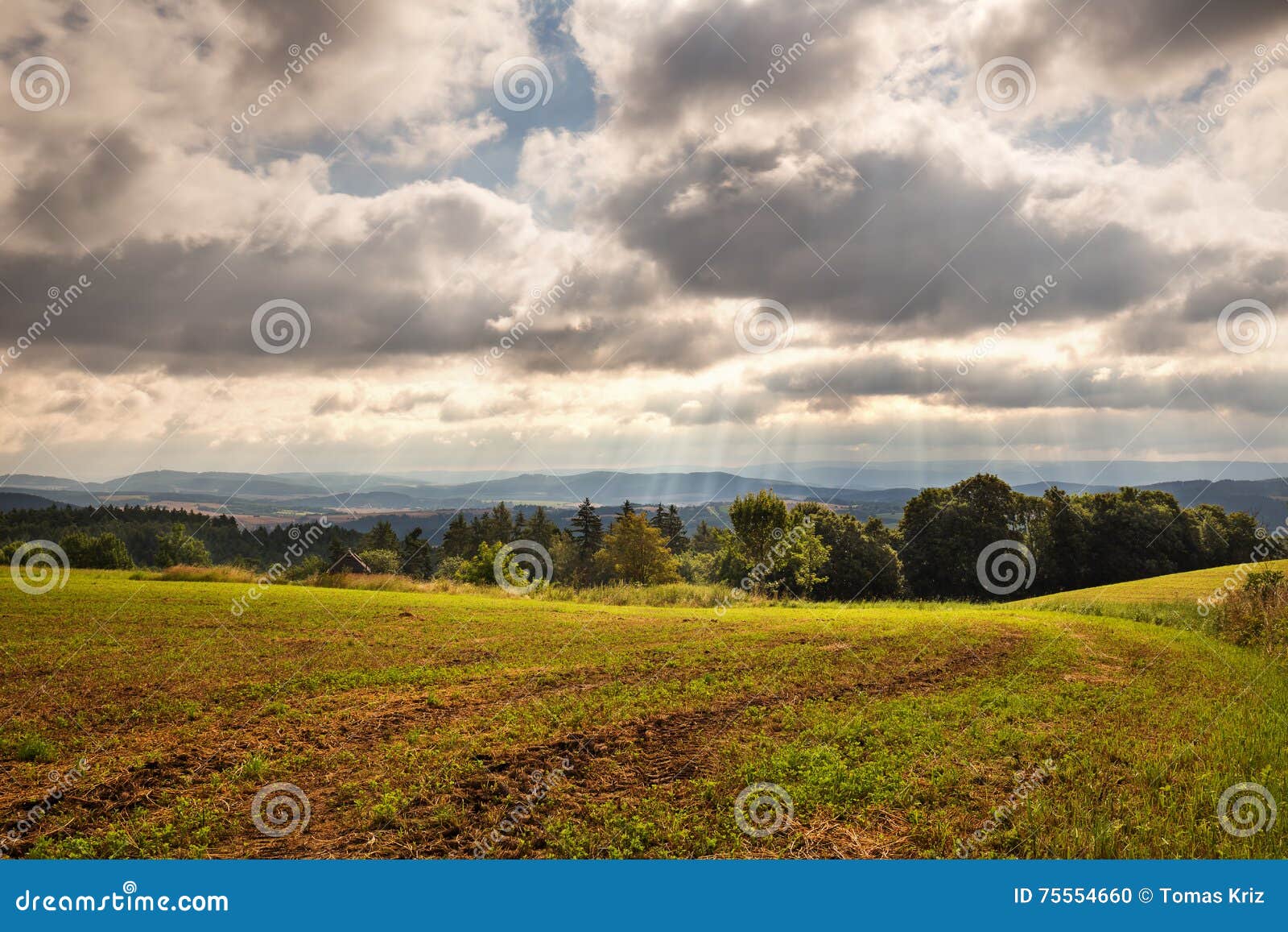 Sun Rays Shining through the Clouds on Landscape Stock Photo - Image of ...